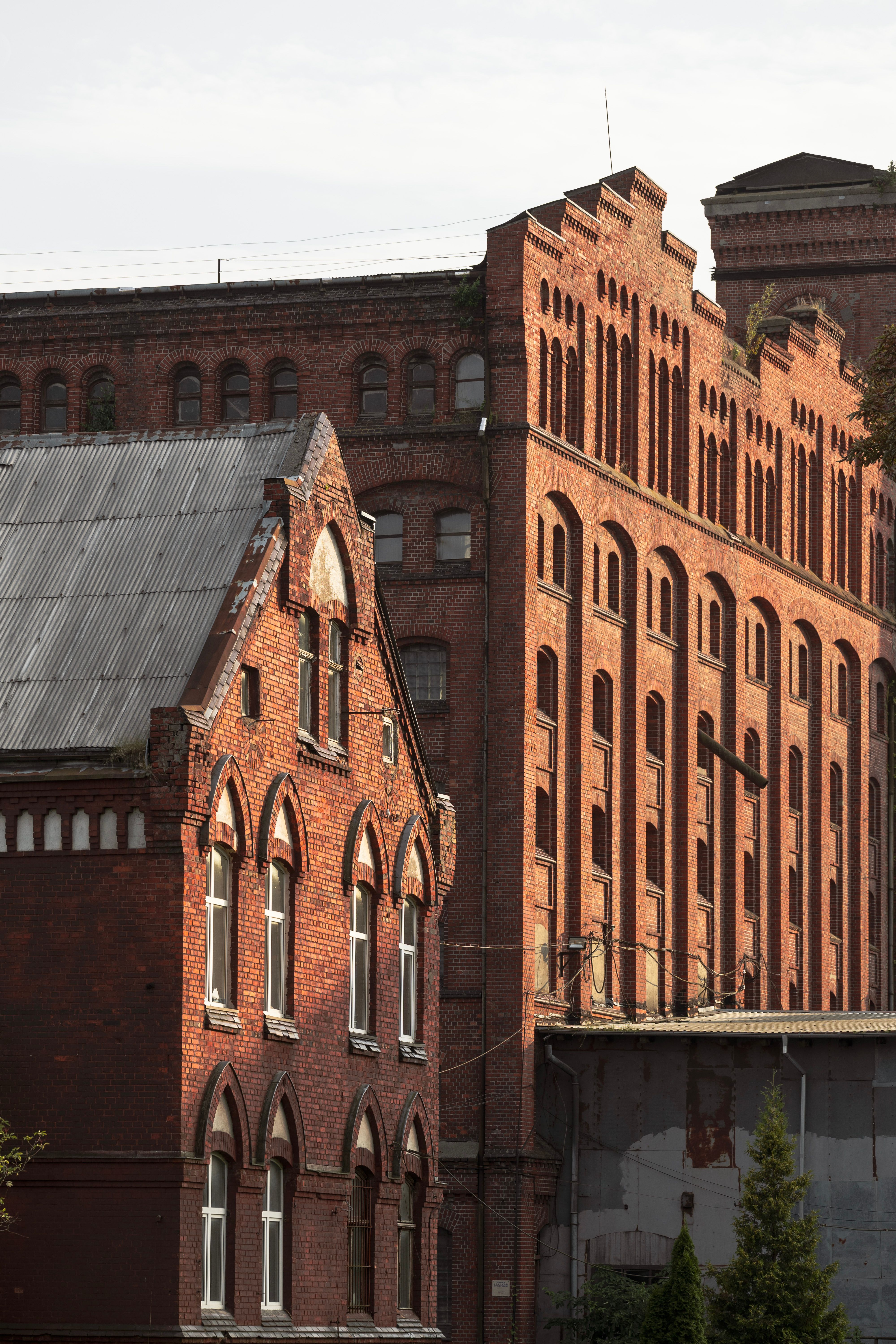 Historic Brick Industrial Buildings under Daylight · Free Stock Photo