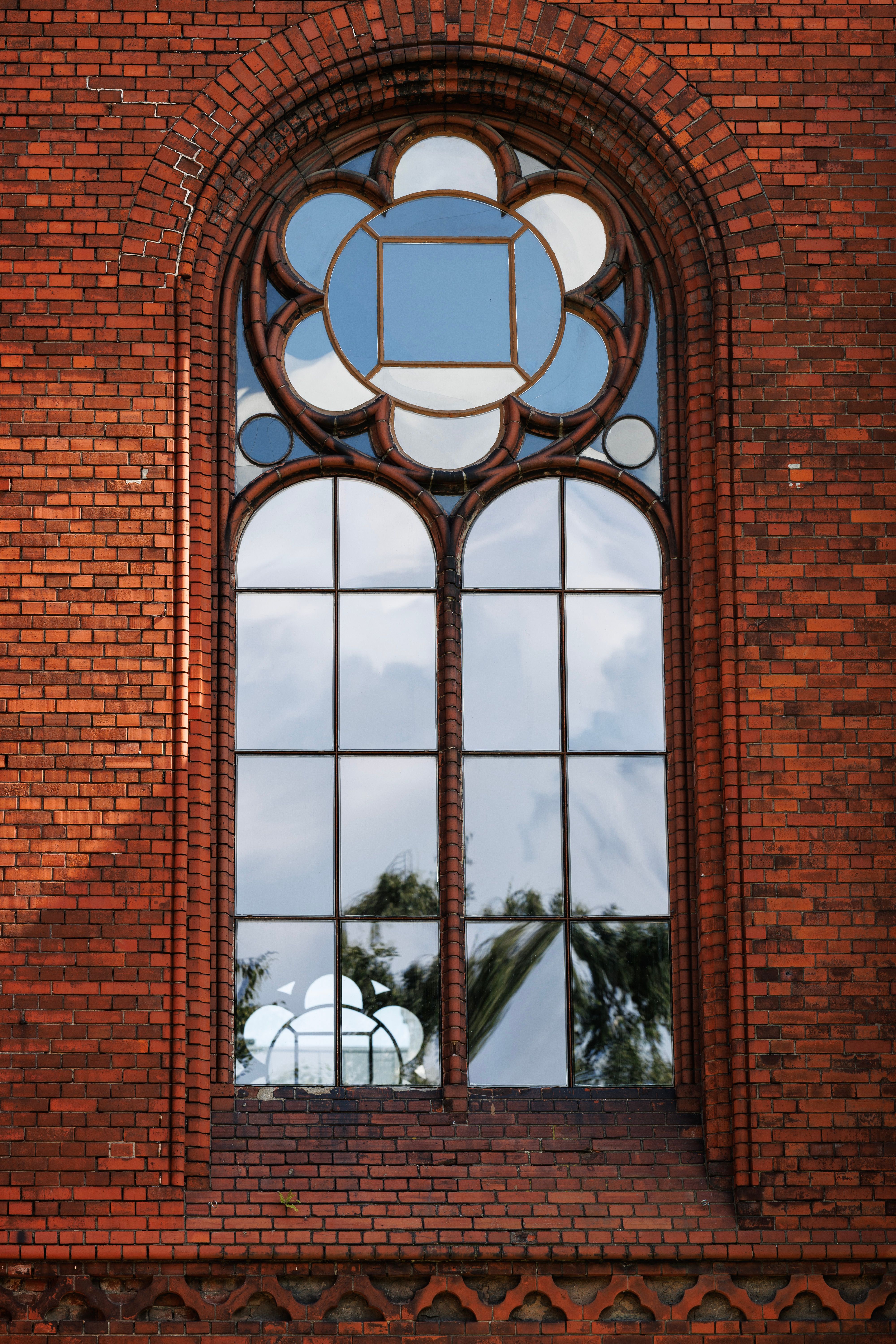 Historic Brick Building with Stained Glass Window · Free Stock Photo