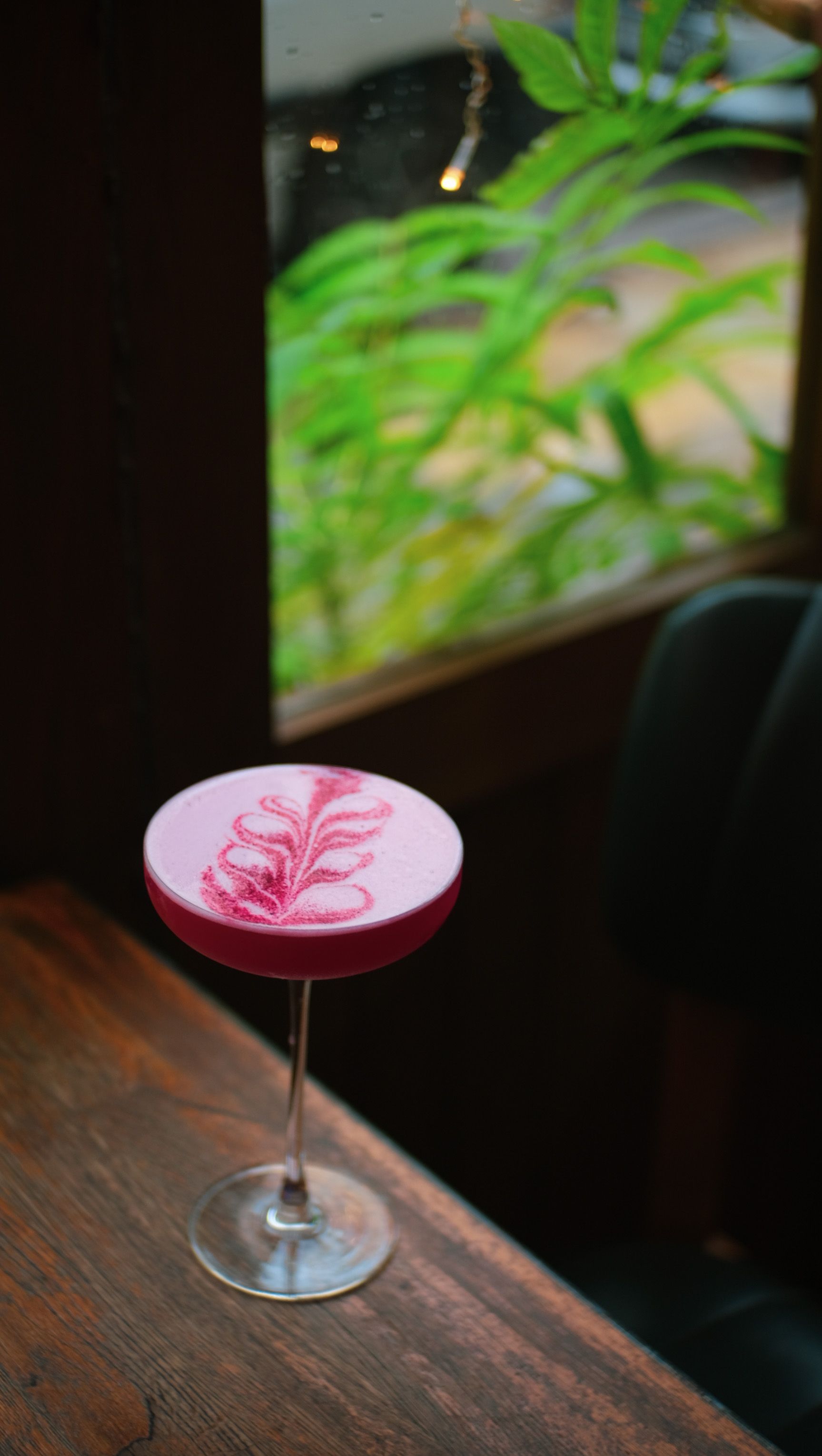 Elegant Pink Cocktail with Artistic Foam Design · Free Stock Photo