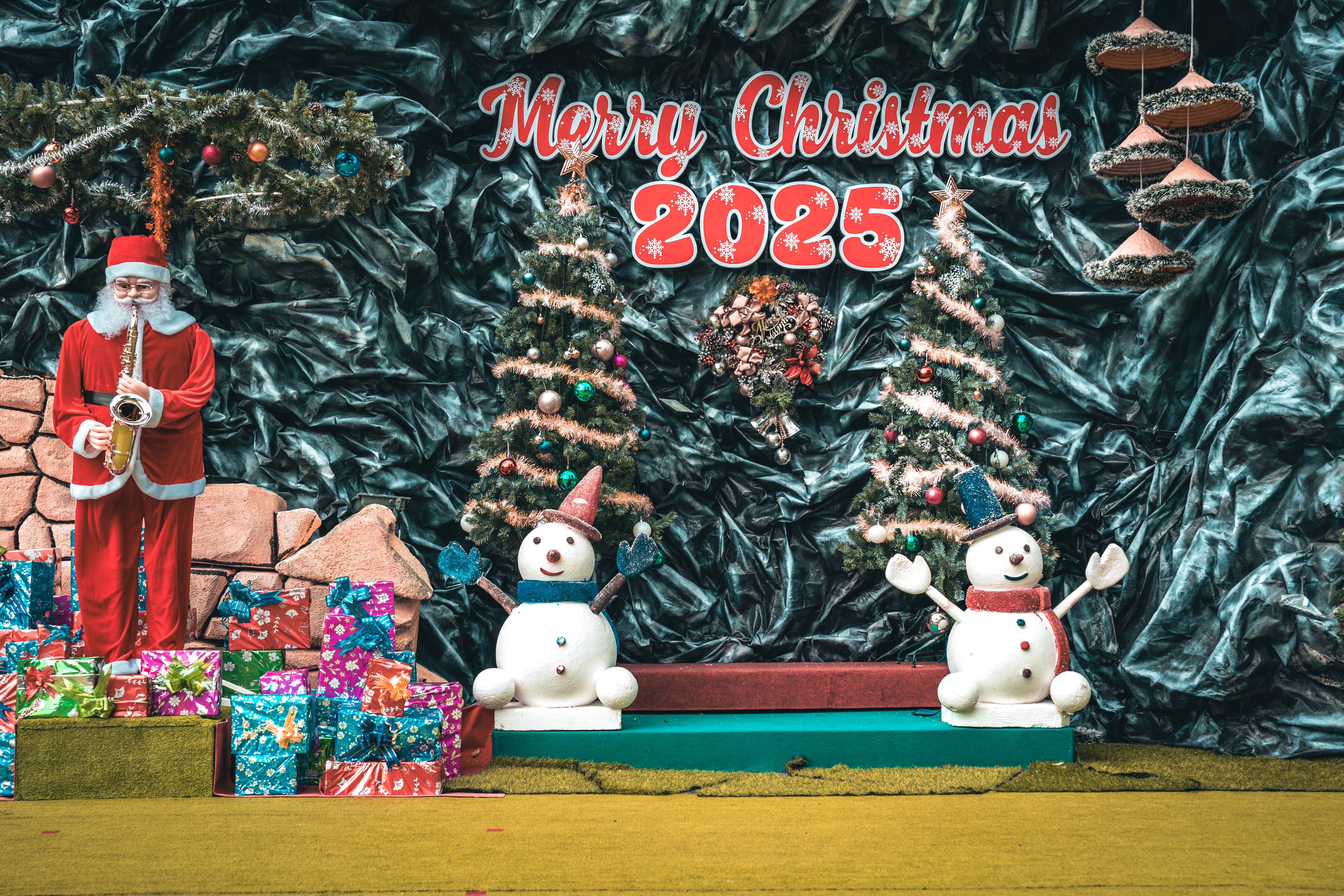 Festive Christmas Display with Santa and Snowmen · Free Stock Photo