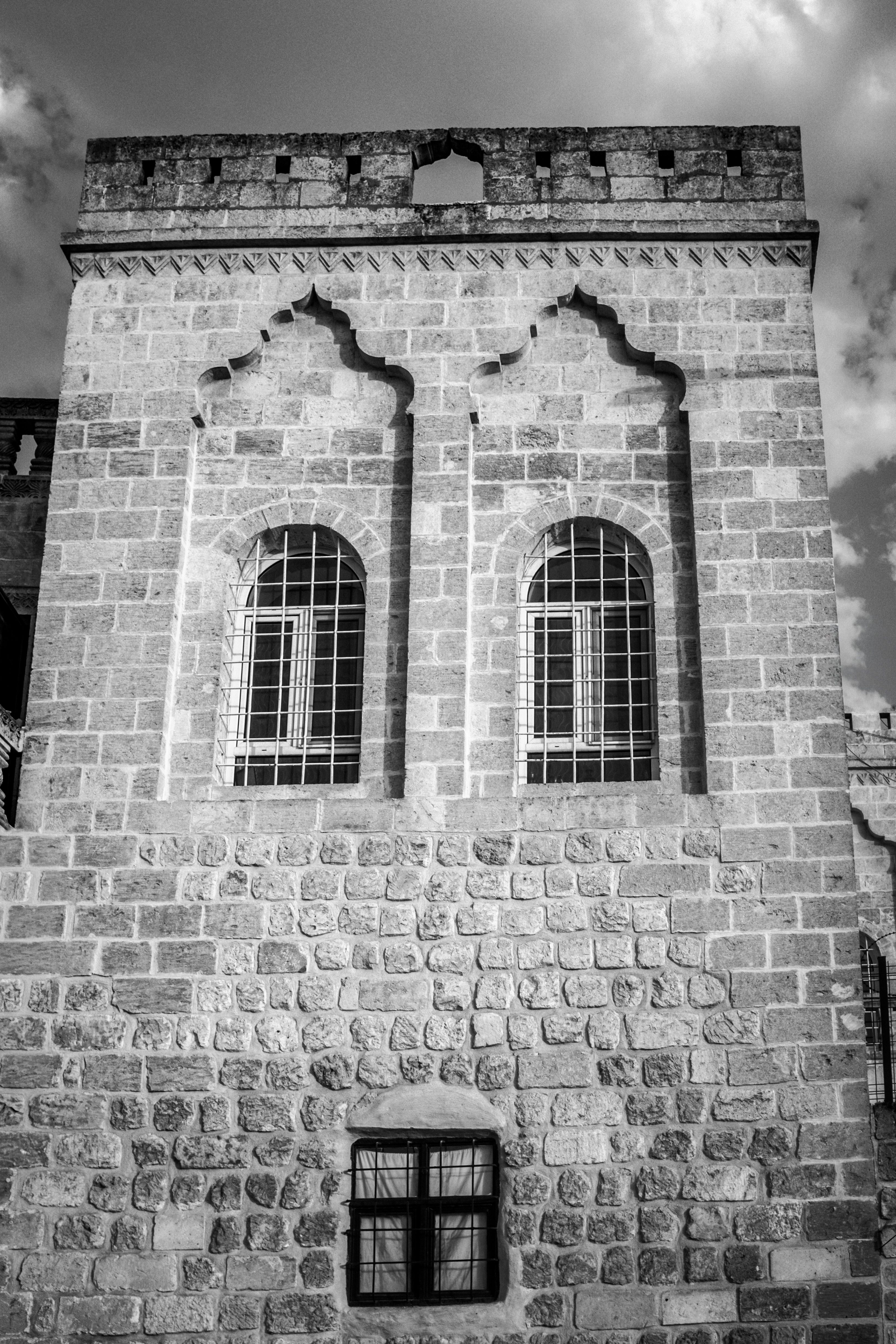Historic Stone Building with Arched Windows · Free Stock Photo