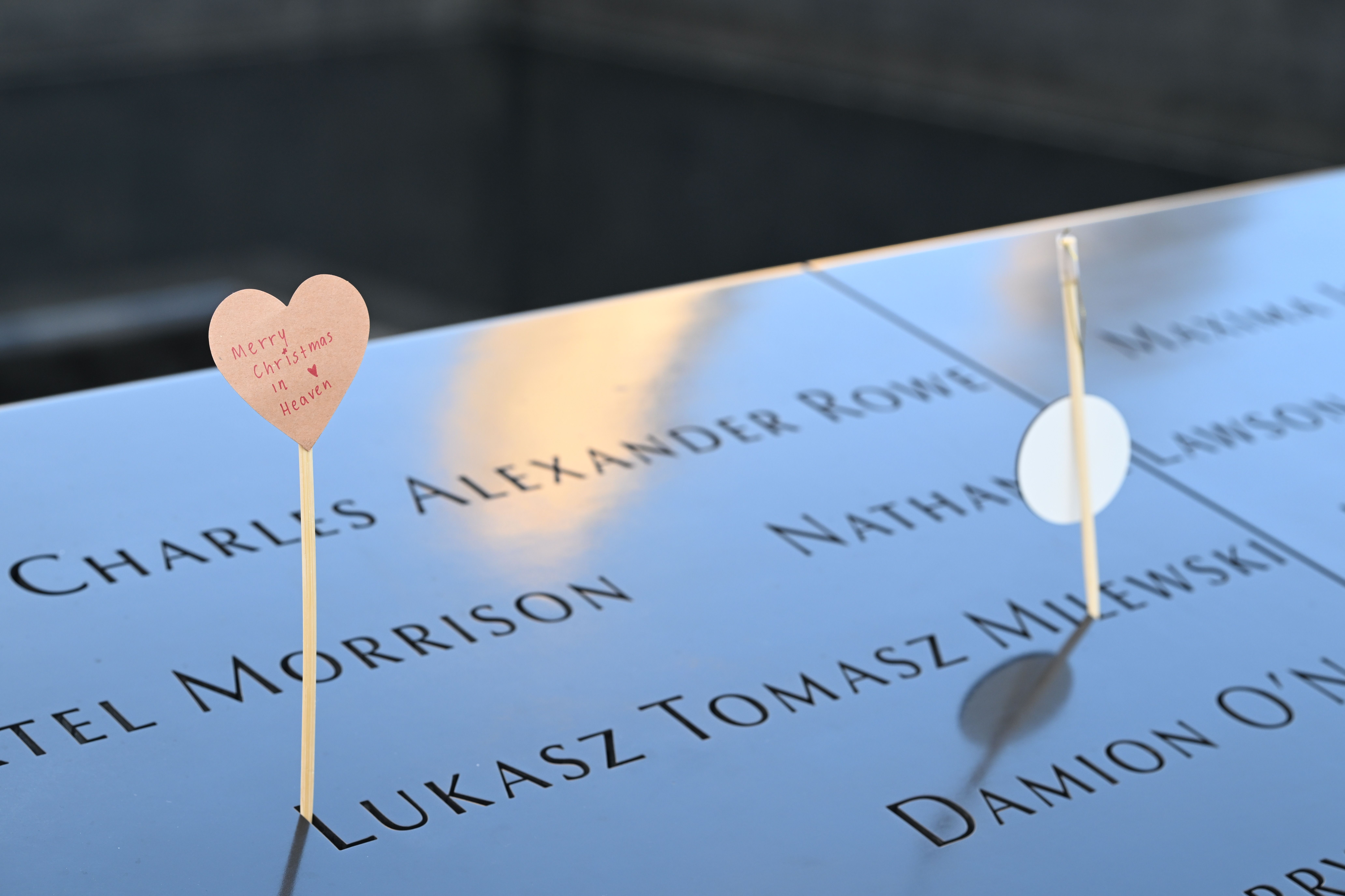 Heartfelt tribute at memorial with names inscribed · Free Stock Photo
