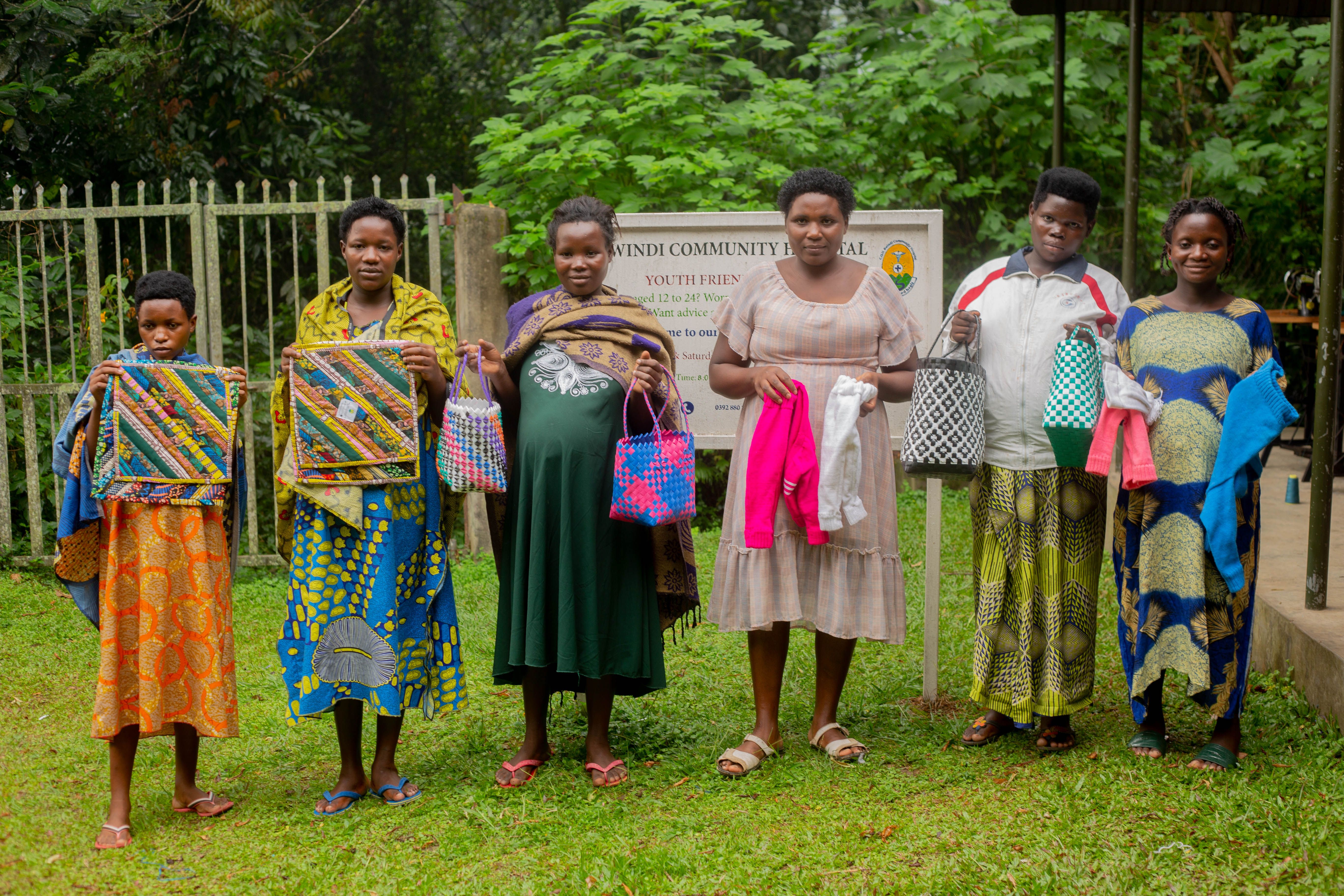 African Women Displaying Handmade Items Outdoors · Free Stock Photo