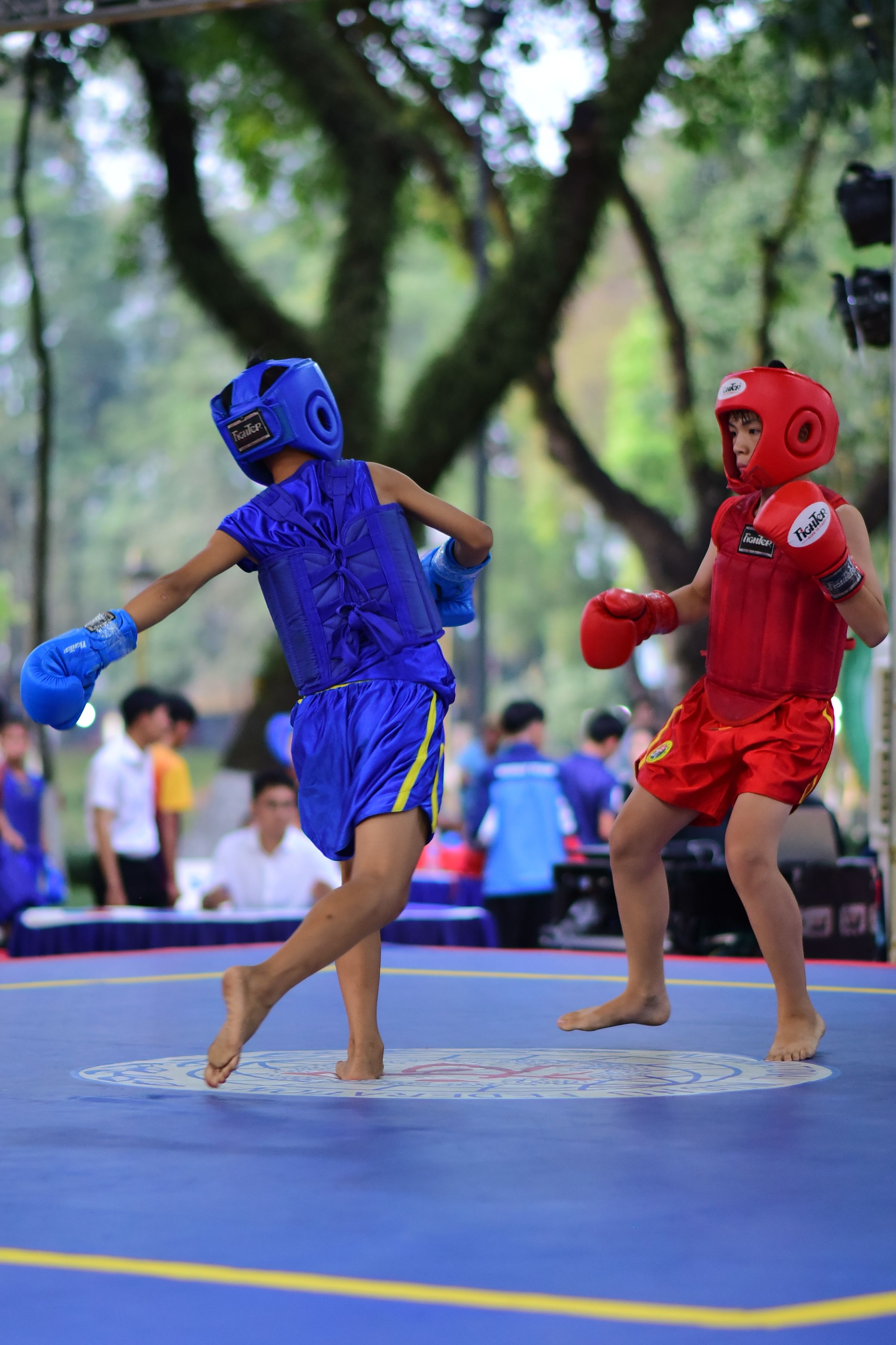 Youth Boxing Match in Outdoor Ring · Free Stock Photo