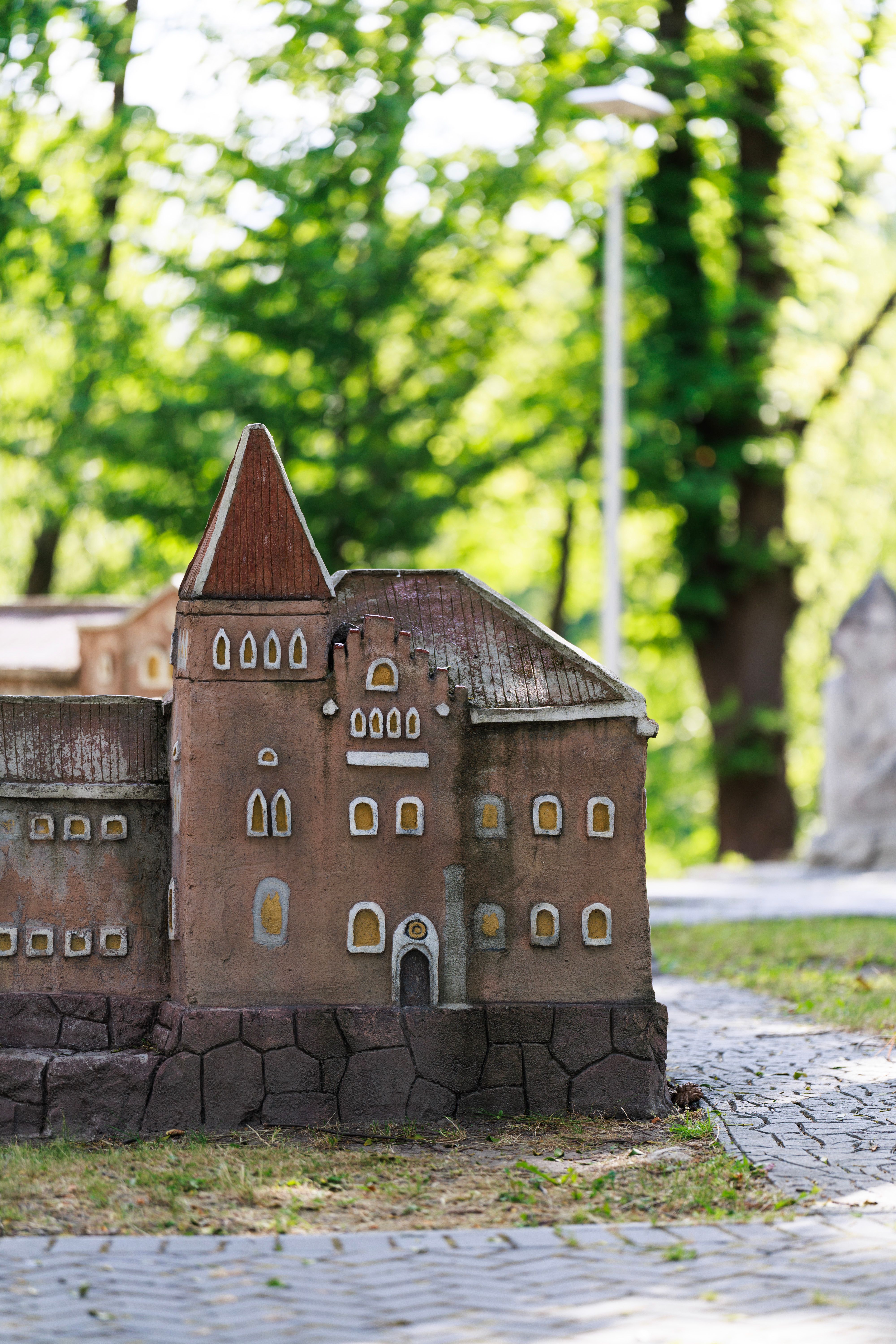 Miniature Castle Model in Sunlit Park · Free Stock Photo