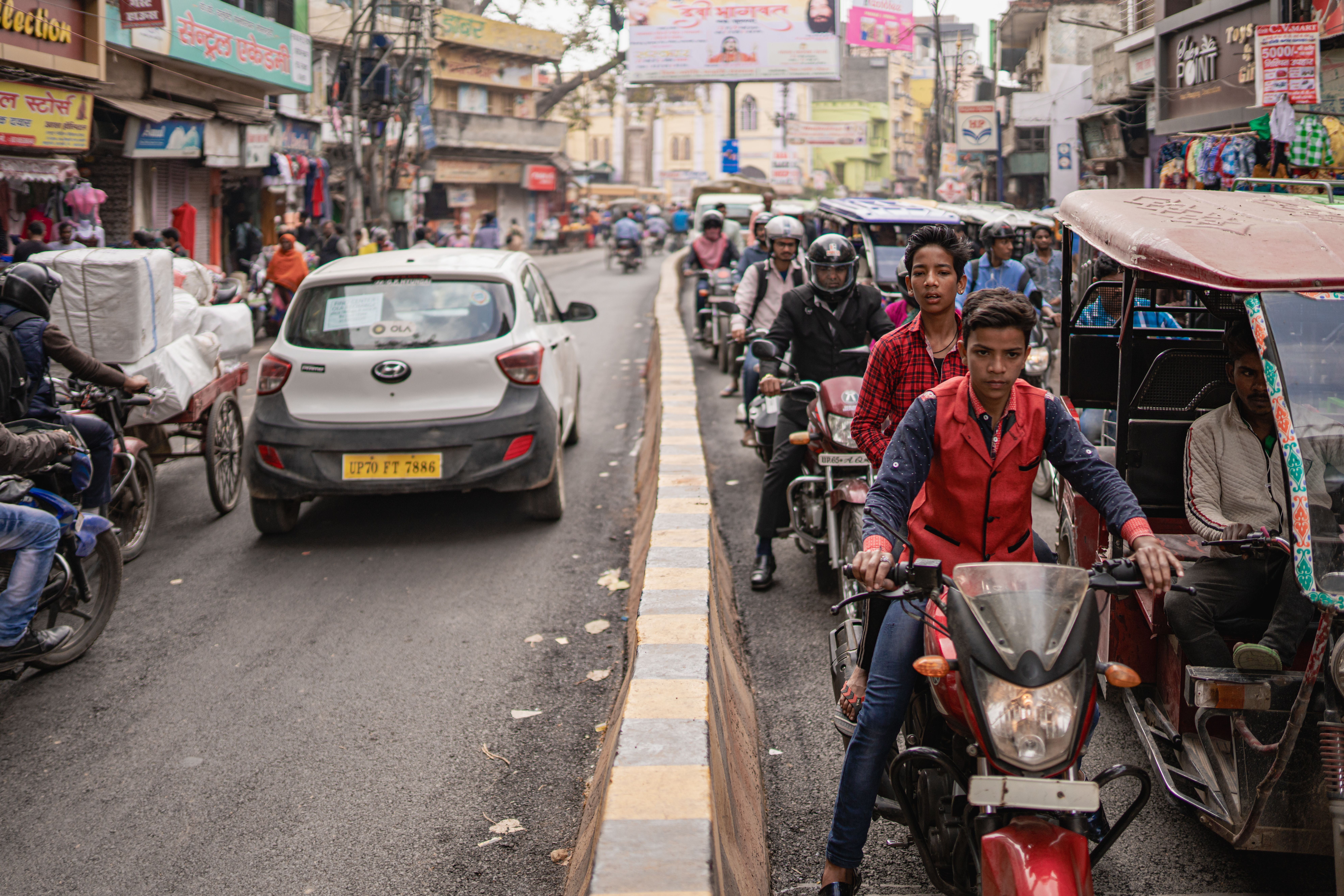 Busy Street Scene in Varanasi with Motorbikes · Free Stock Photo