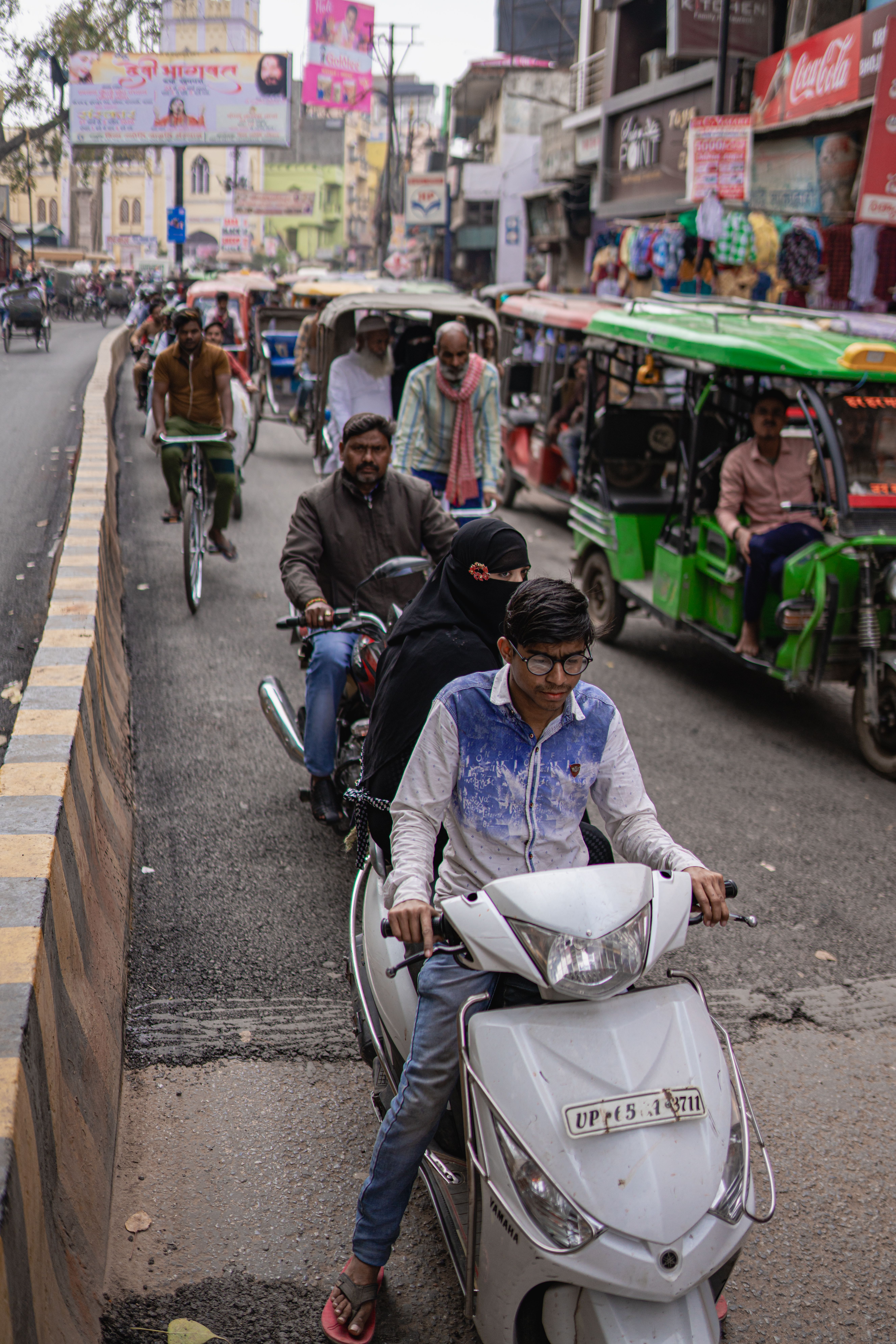 Bustling Street Scene with Tuk Tuks in Varanasi · Free Stock Photo