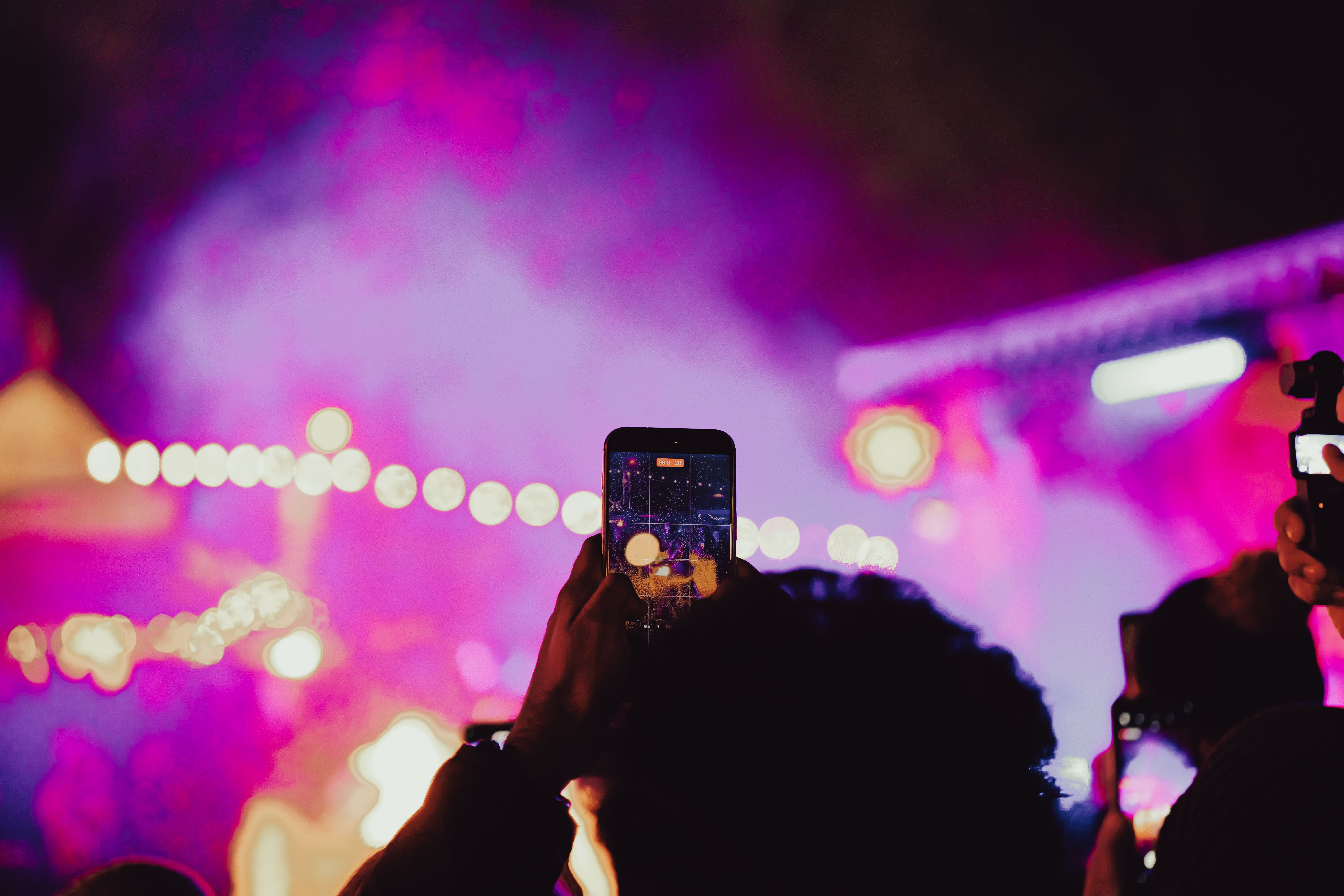 Vibrant Concert Night with Smartphone Captures · Free Stock Photo