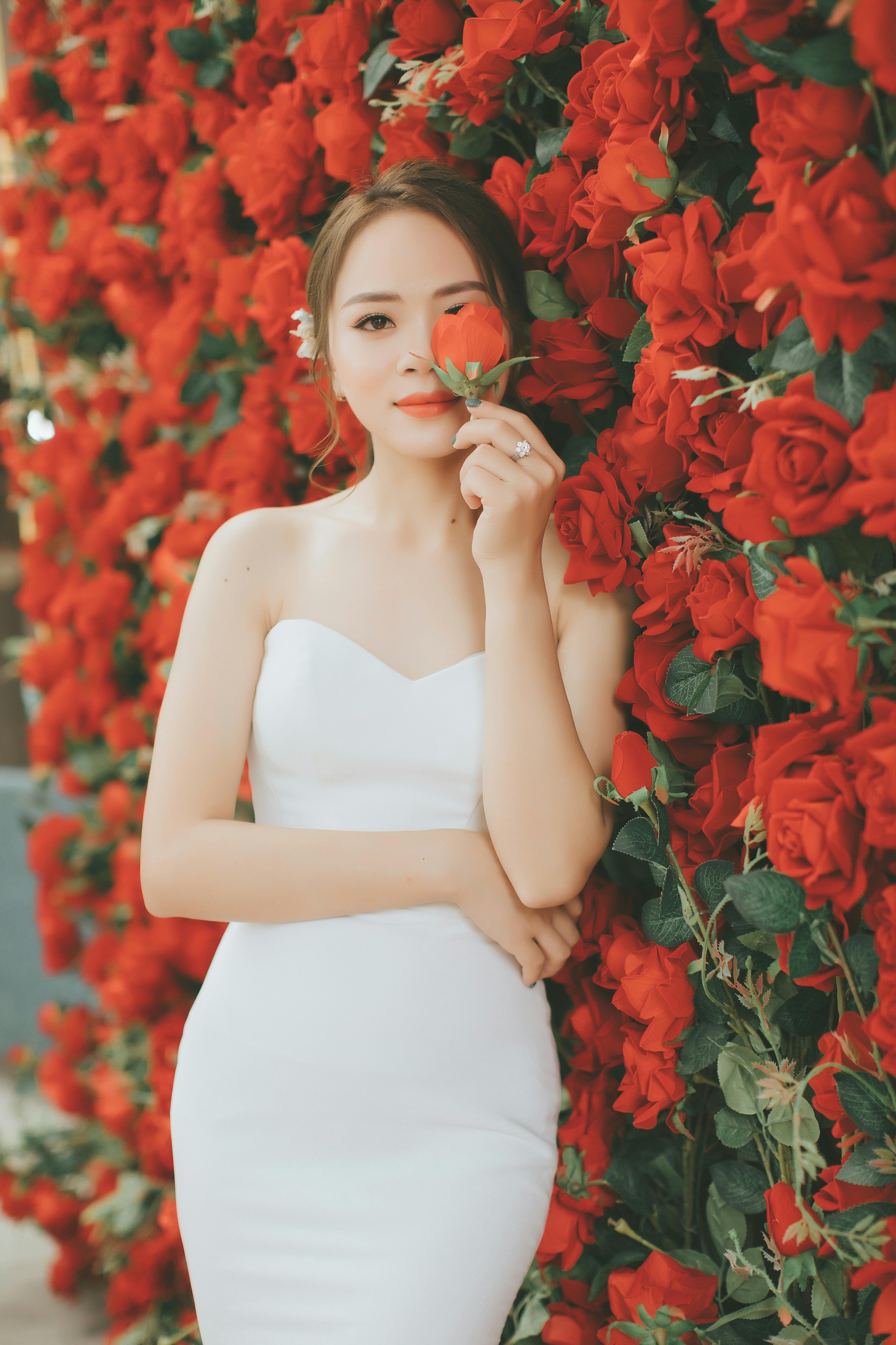 Woman Holding Red Rose · Free Stock Photo
