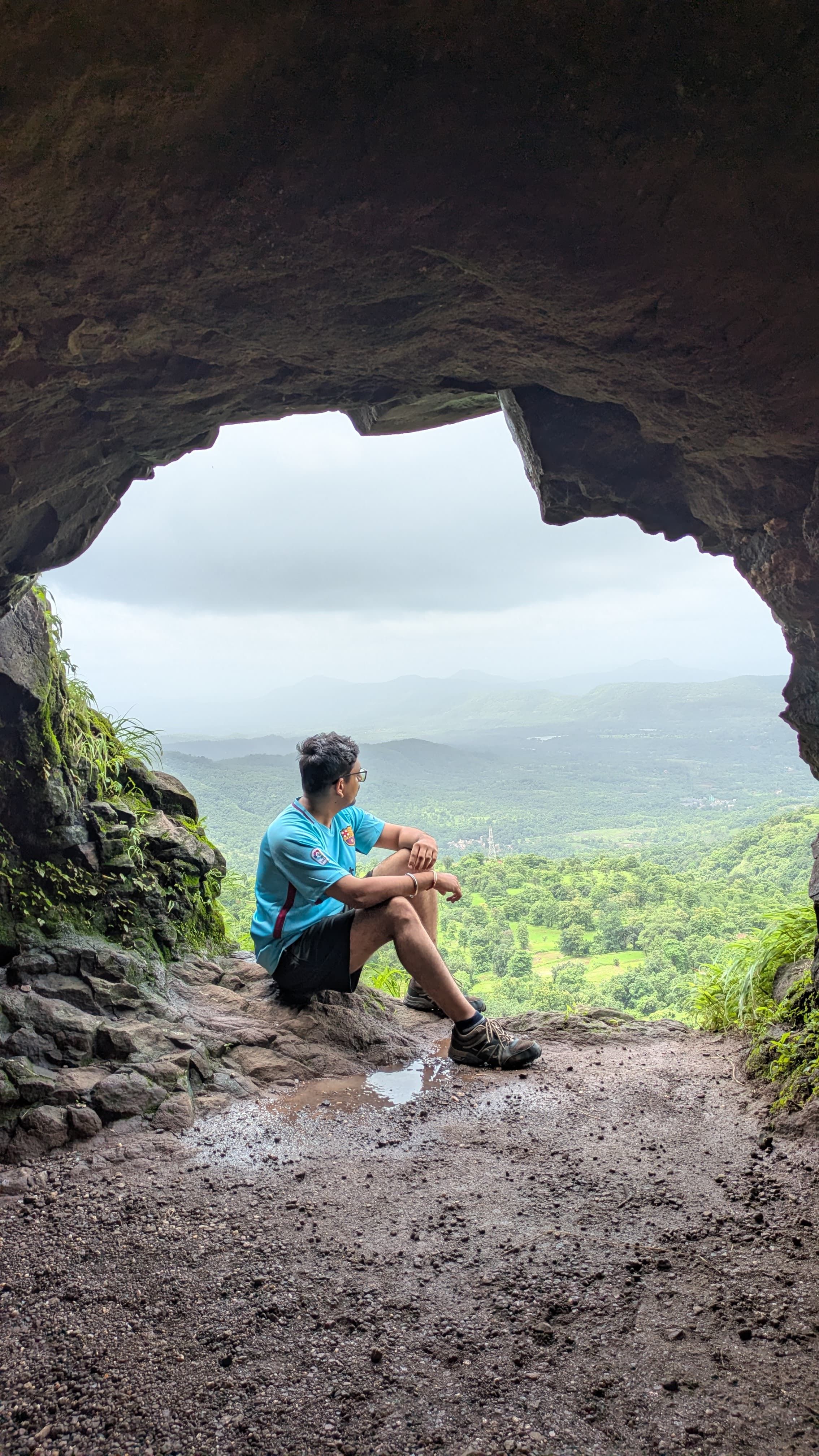Man Relaxing in Scenic Mountain Cave View · Free Stock Photo