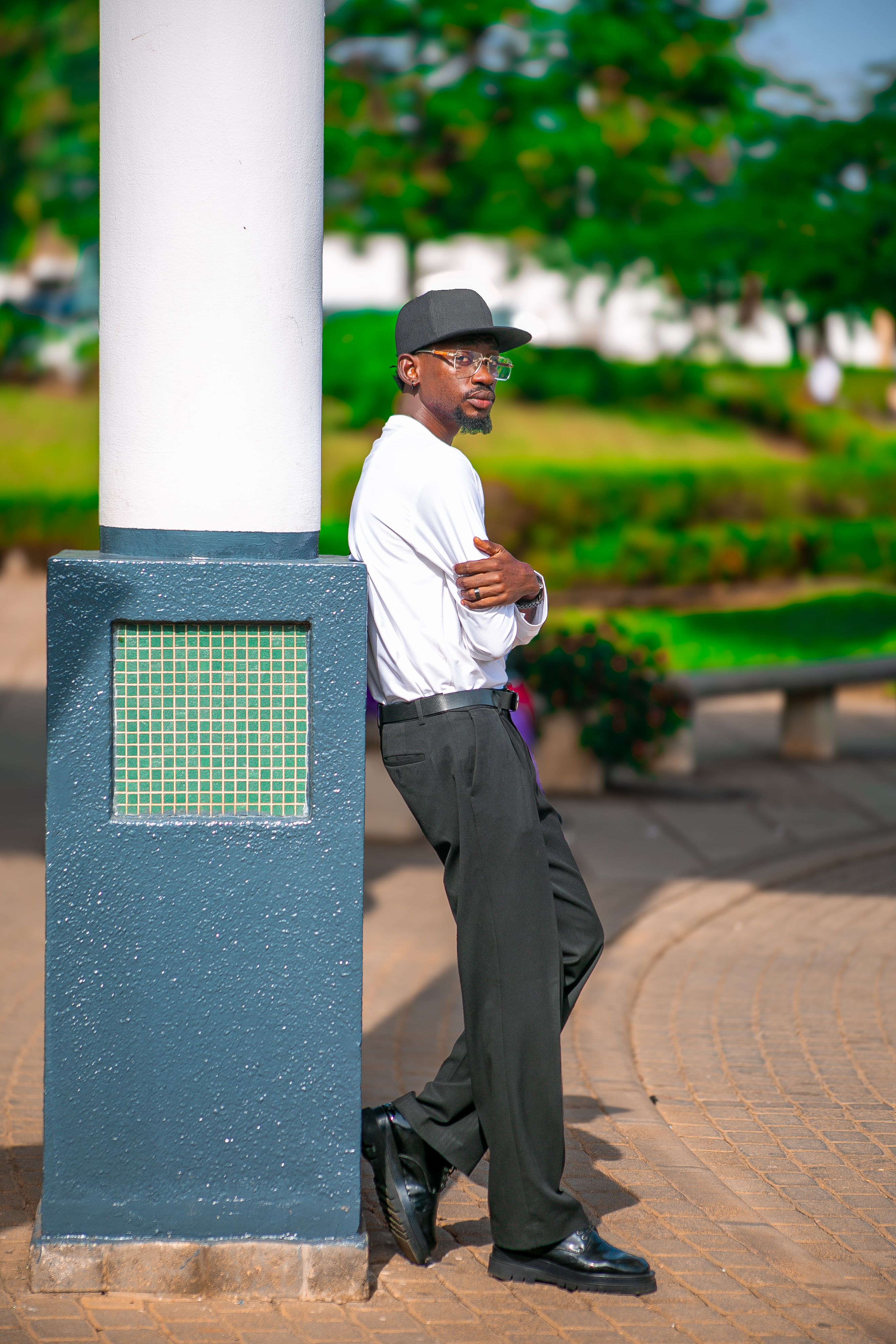 Stylish Man Leaning Against Column Outdoors · Free Stock Photo