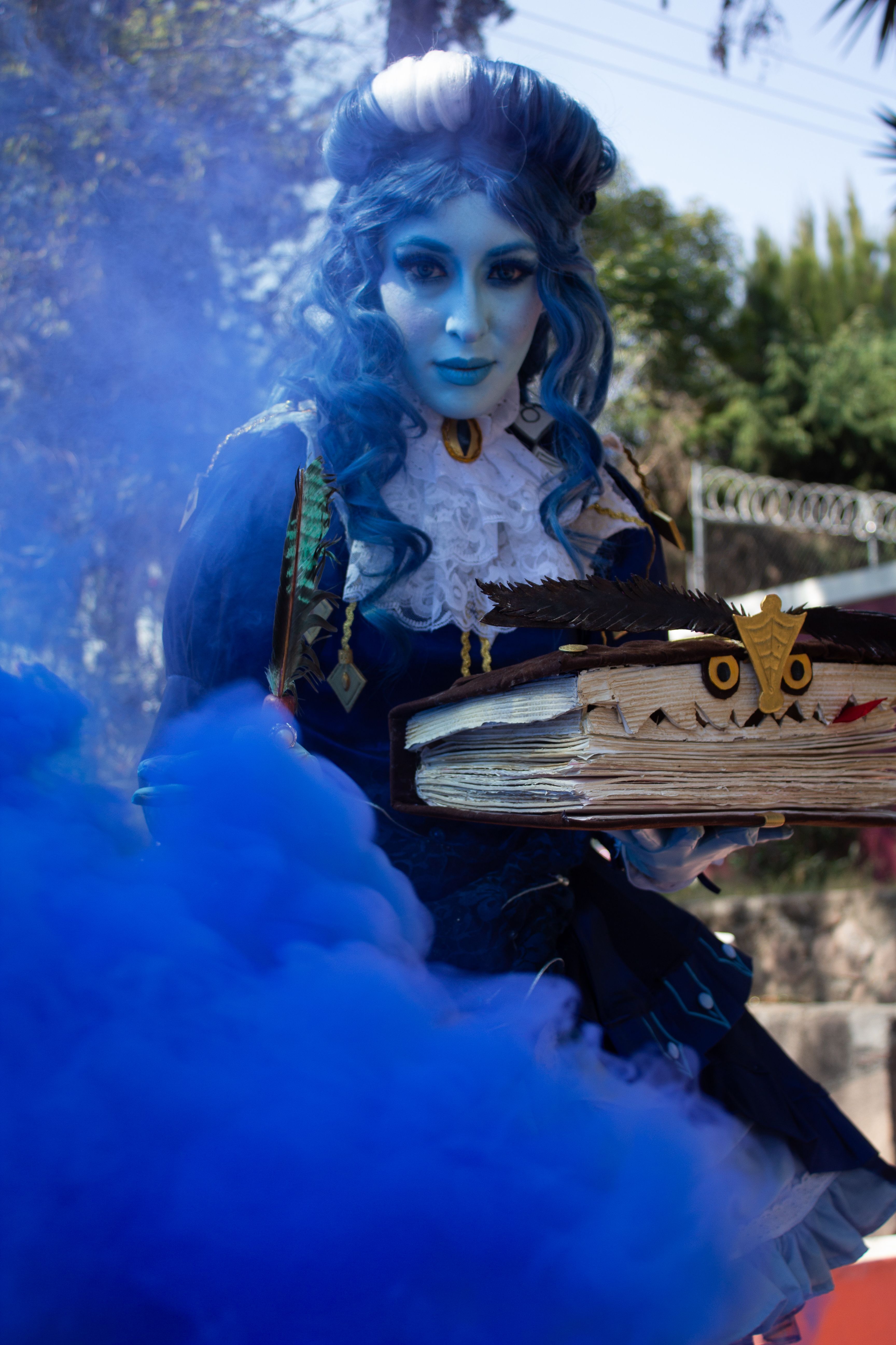Blue Fantasy Cosplay with Enchanted Book · Free Stock Photo