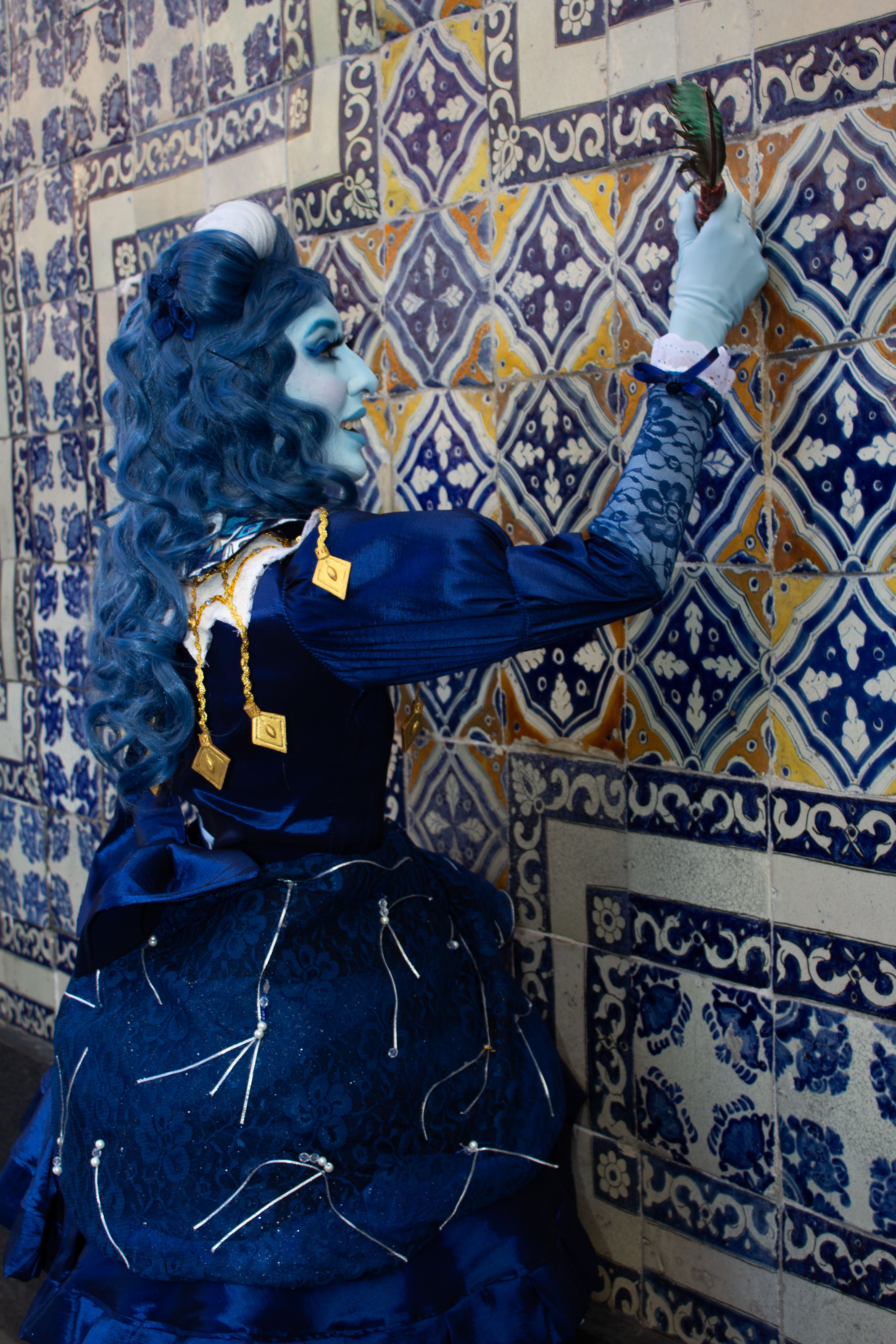 Cosplay Character Admires Decorative Tiles · Free Stock Photo