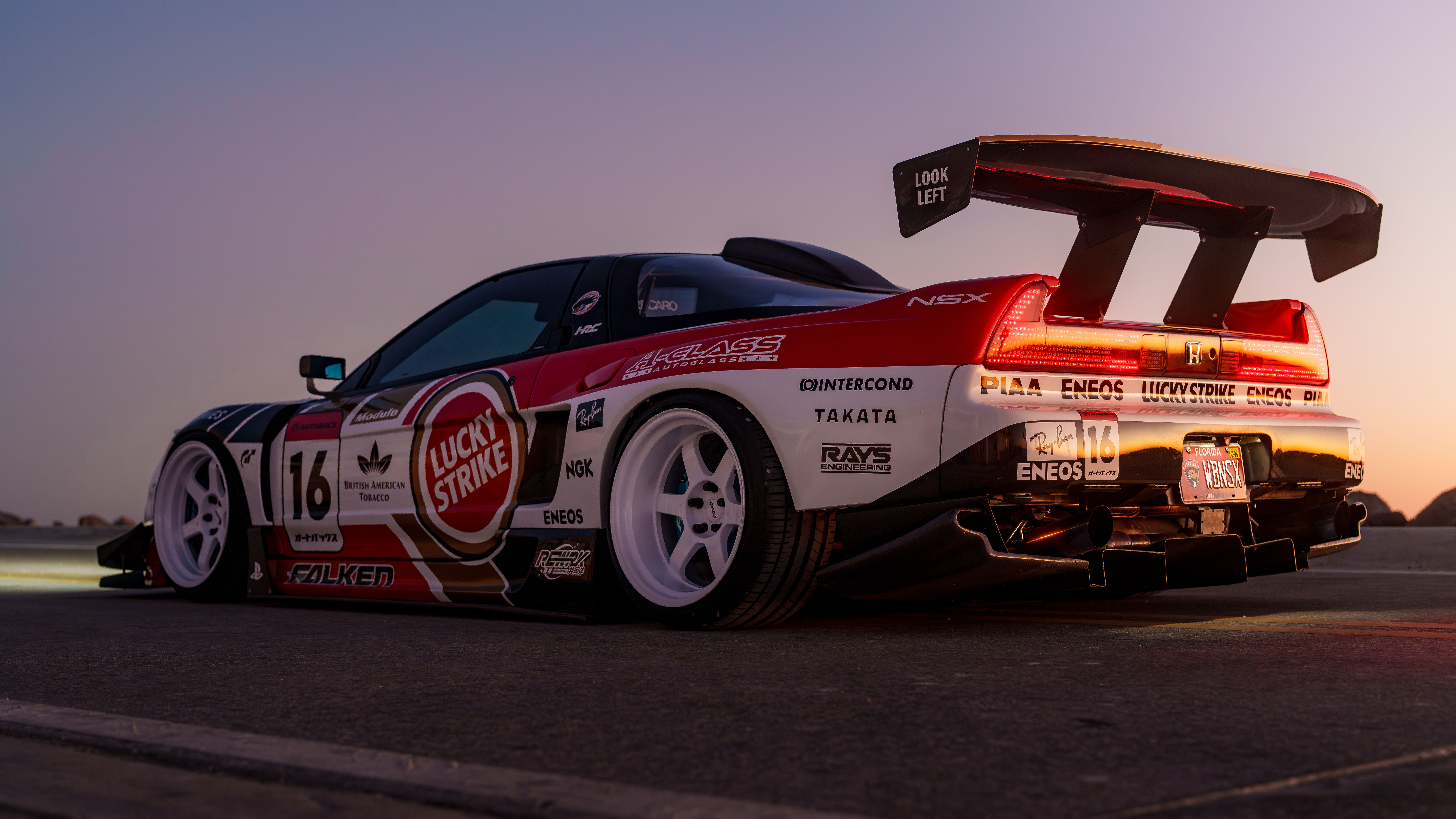 Racing Car at Sunset on Open Road · Free Stock Photo