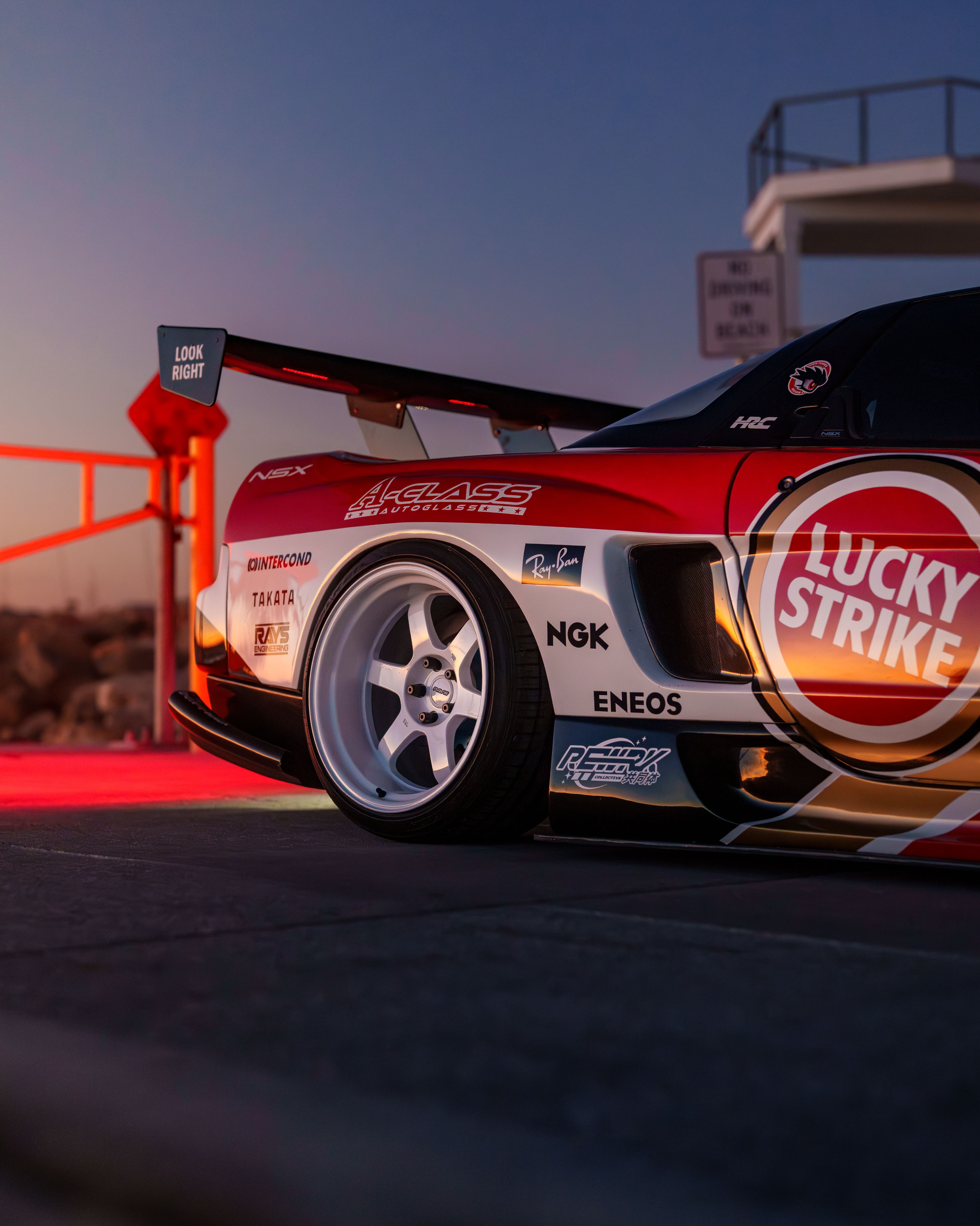 Vibrant Racing Car at Sunset with Striking Decal · Free Stock Photo