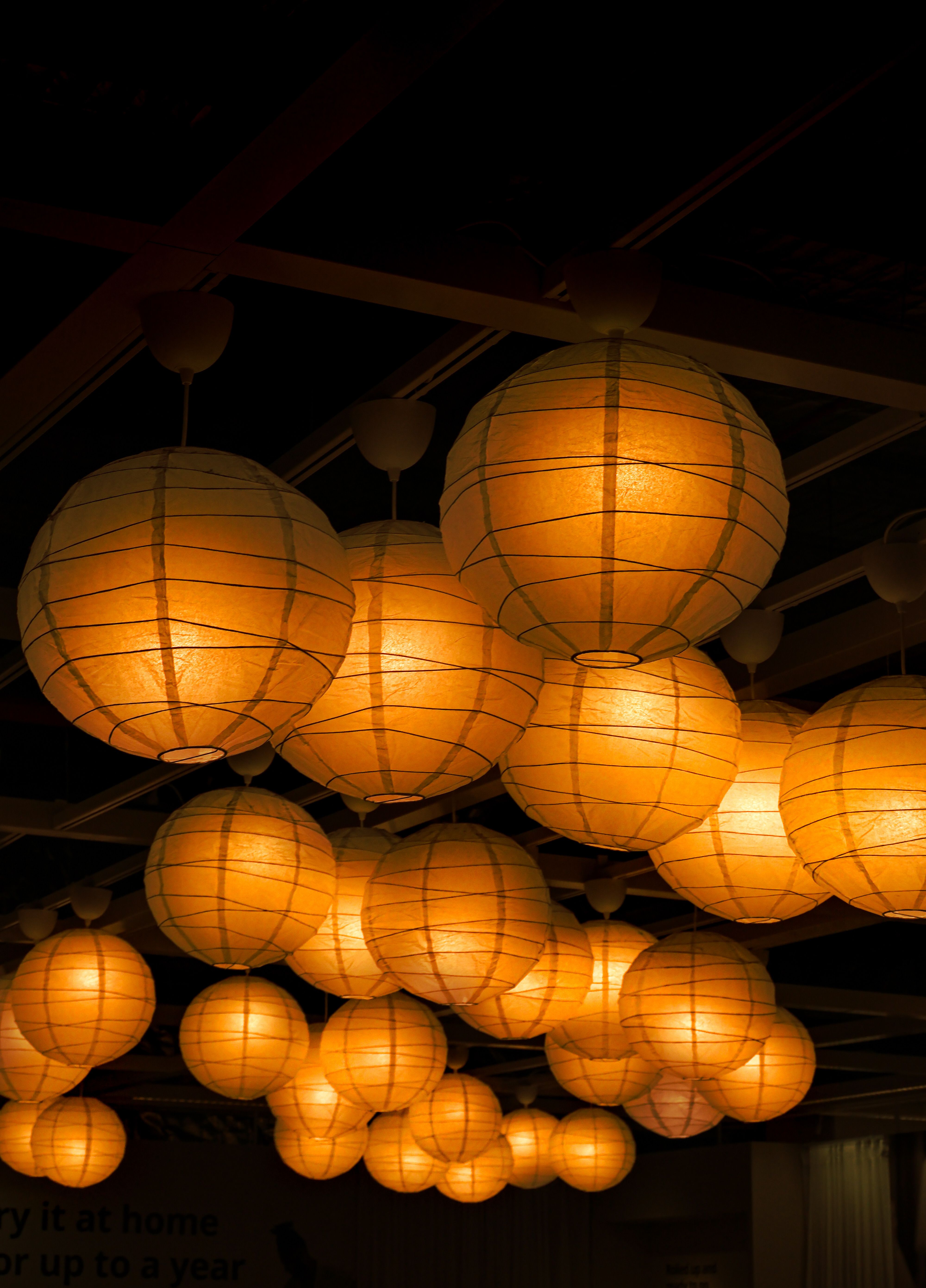 Warm Glow of Hanging Paper Lanterns Indoors · Free Stock Photo