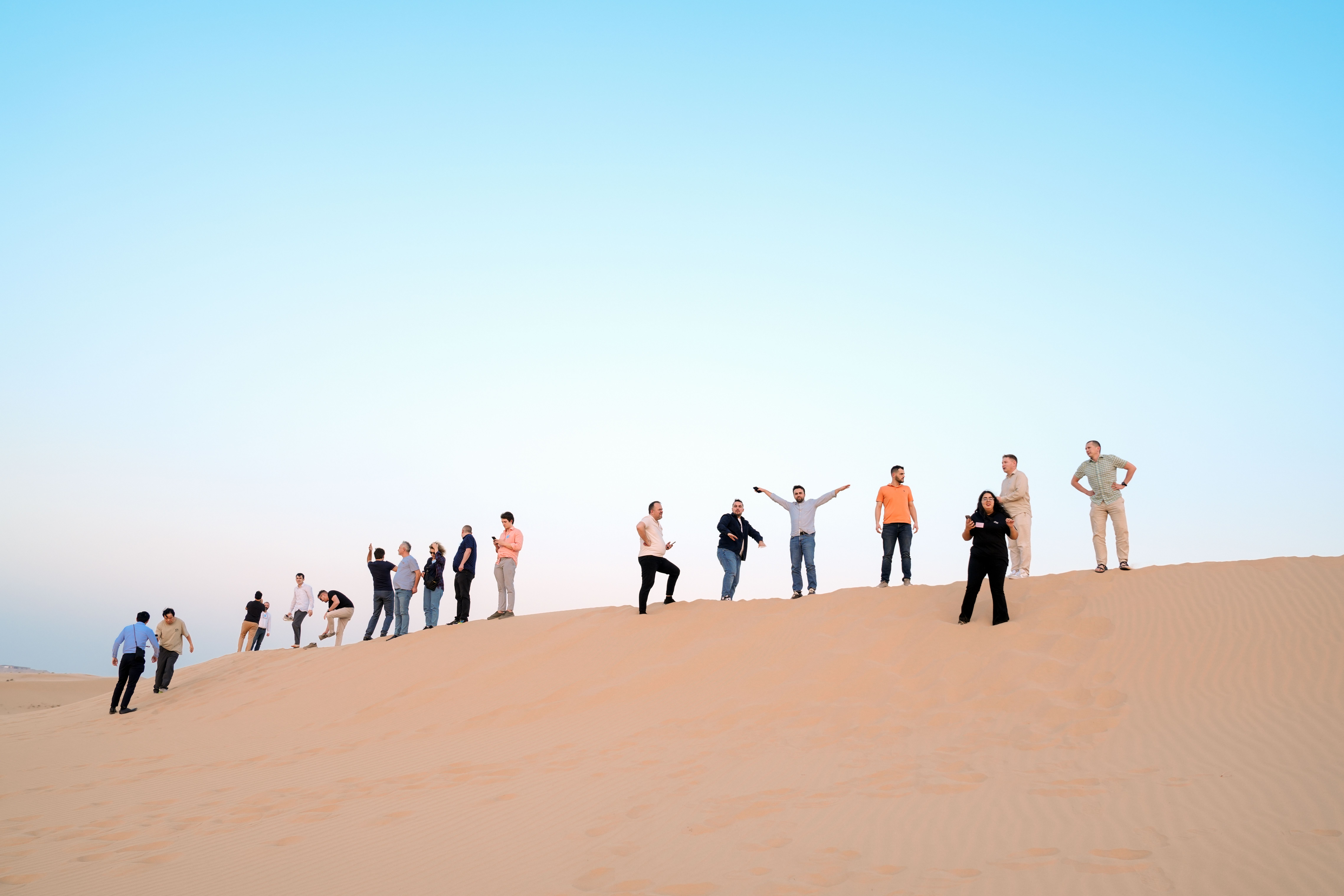 Group of People on Sand Dune at Sunset · Free Stock Photo