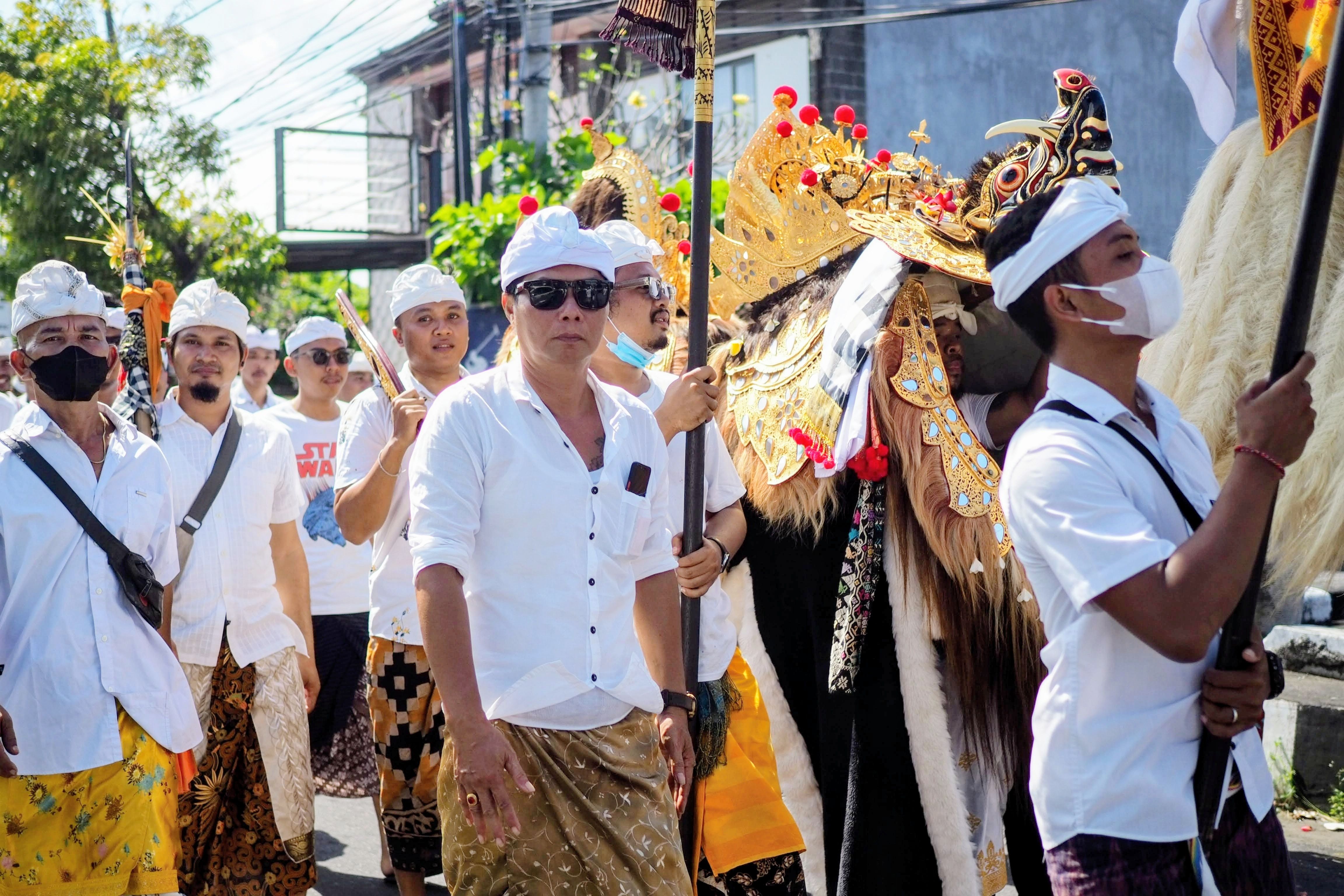 Traditional Balinese Procession with Ornate Costumes · Free Stock Photo