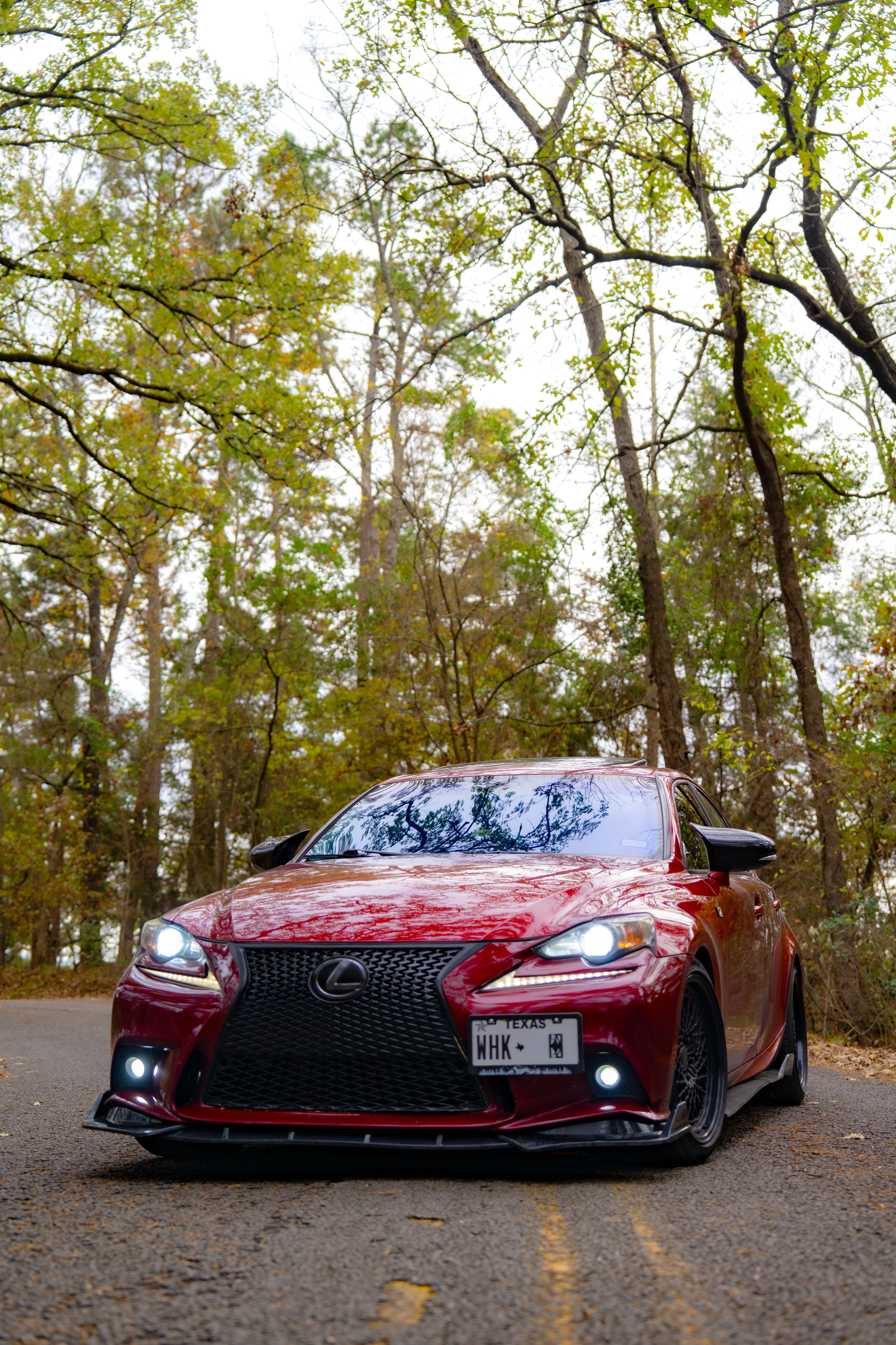 Vibrant Red Lexus on Scenic Texas Road · Free Stock Photo