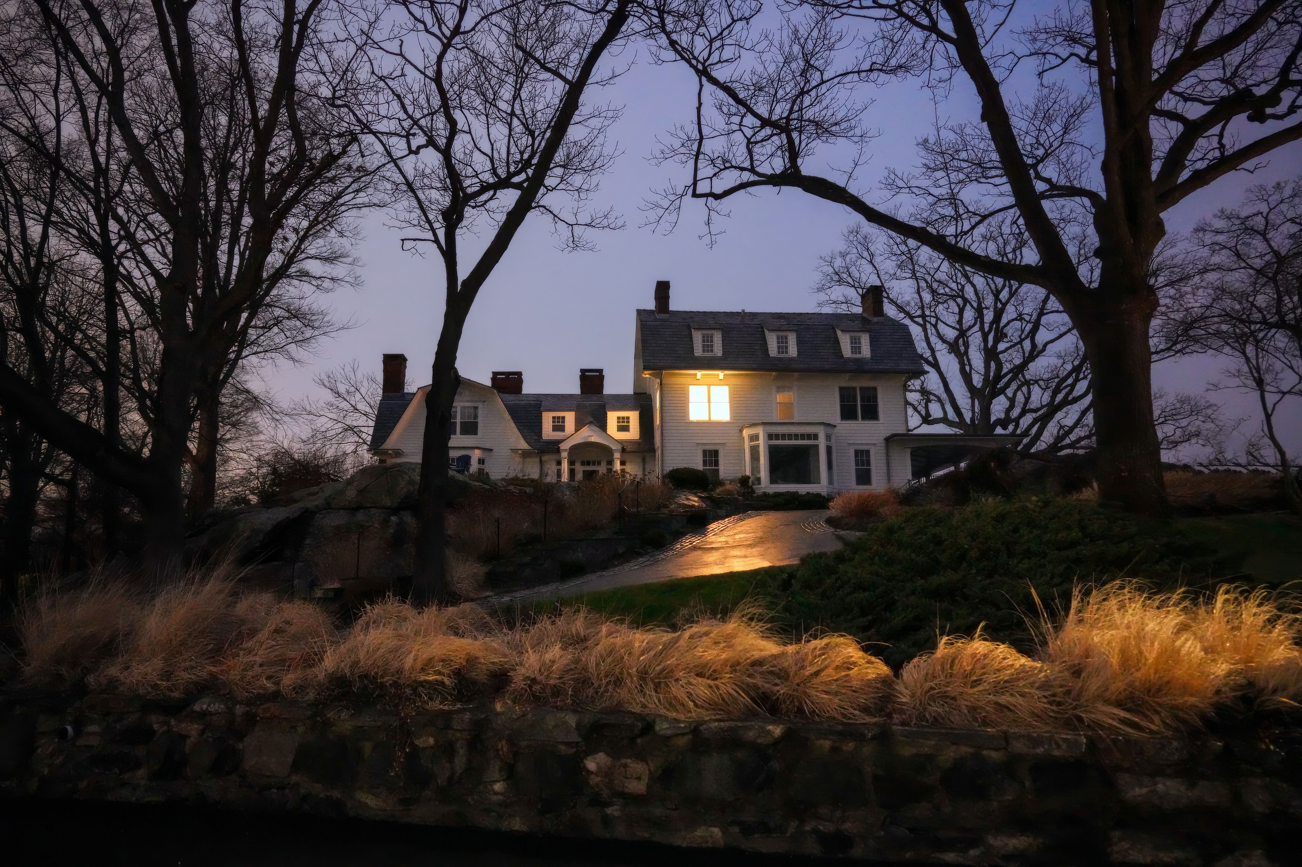 Charming Colonial House at Dusk with Majestic Silhouettes · Free Stock ...