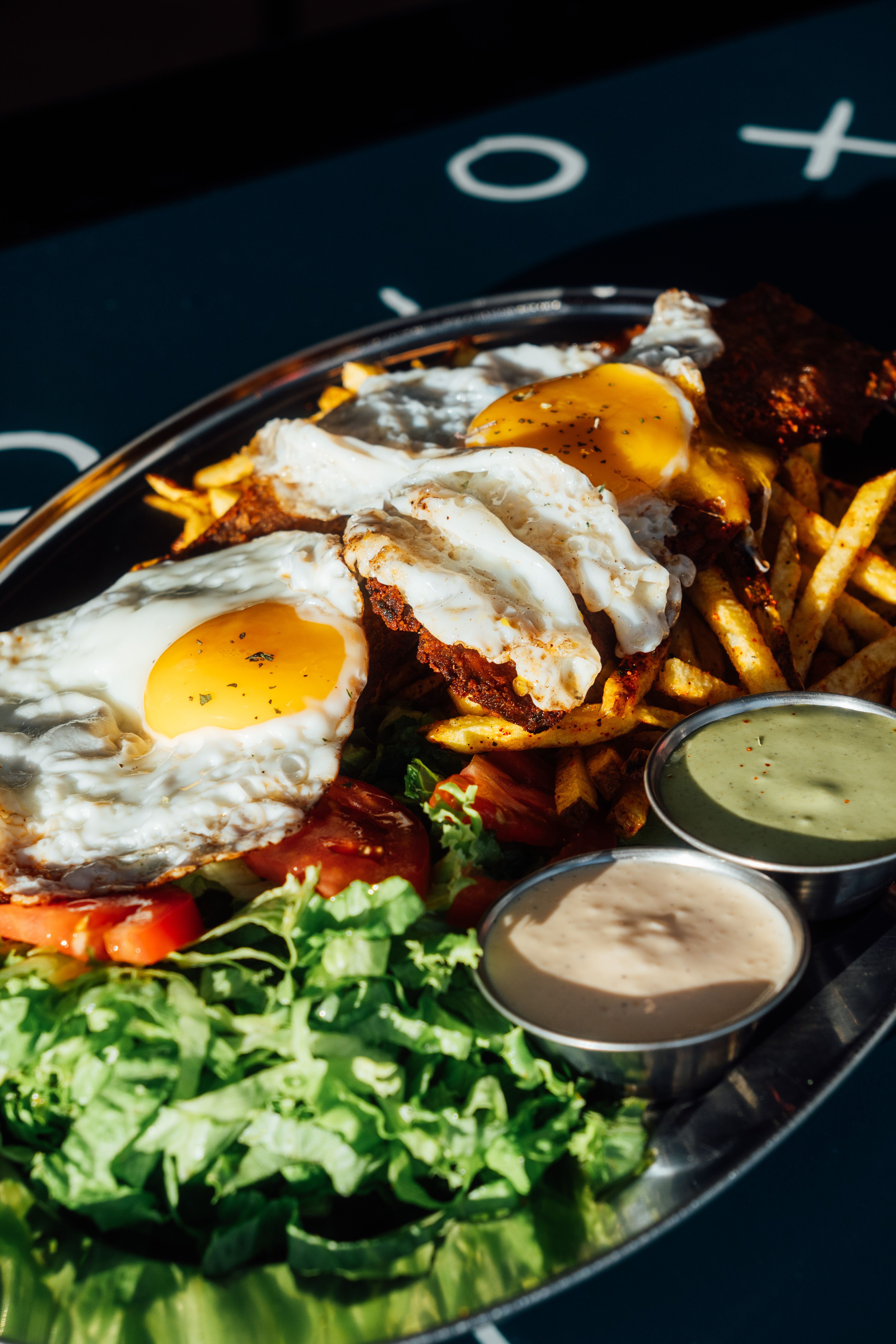 Hearty Breakfast Platter with Eggs and Fries · Free Stock Photo