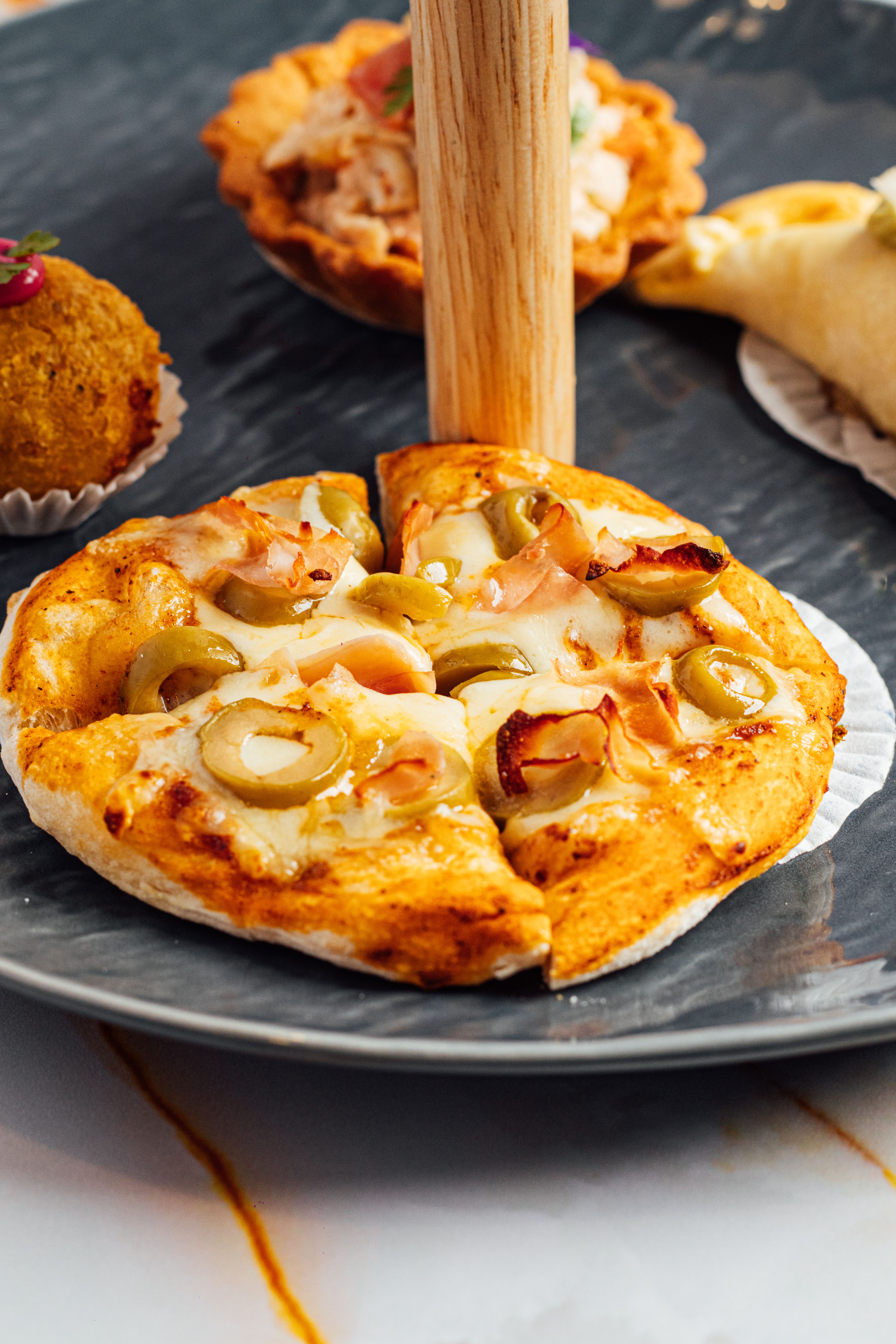 Gourmet Mini Pizza with Assorted Appetizers · Free Stock Photo