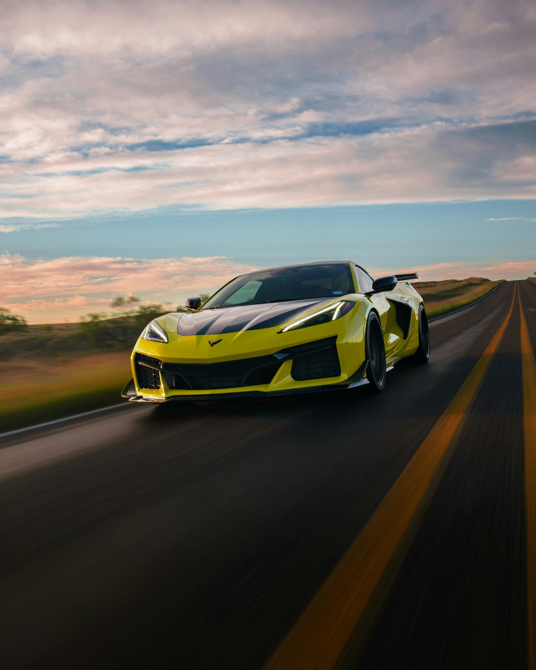Dynamic Sports Car Racing on Open Highway · Free Stock Photo