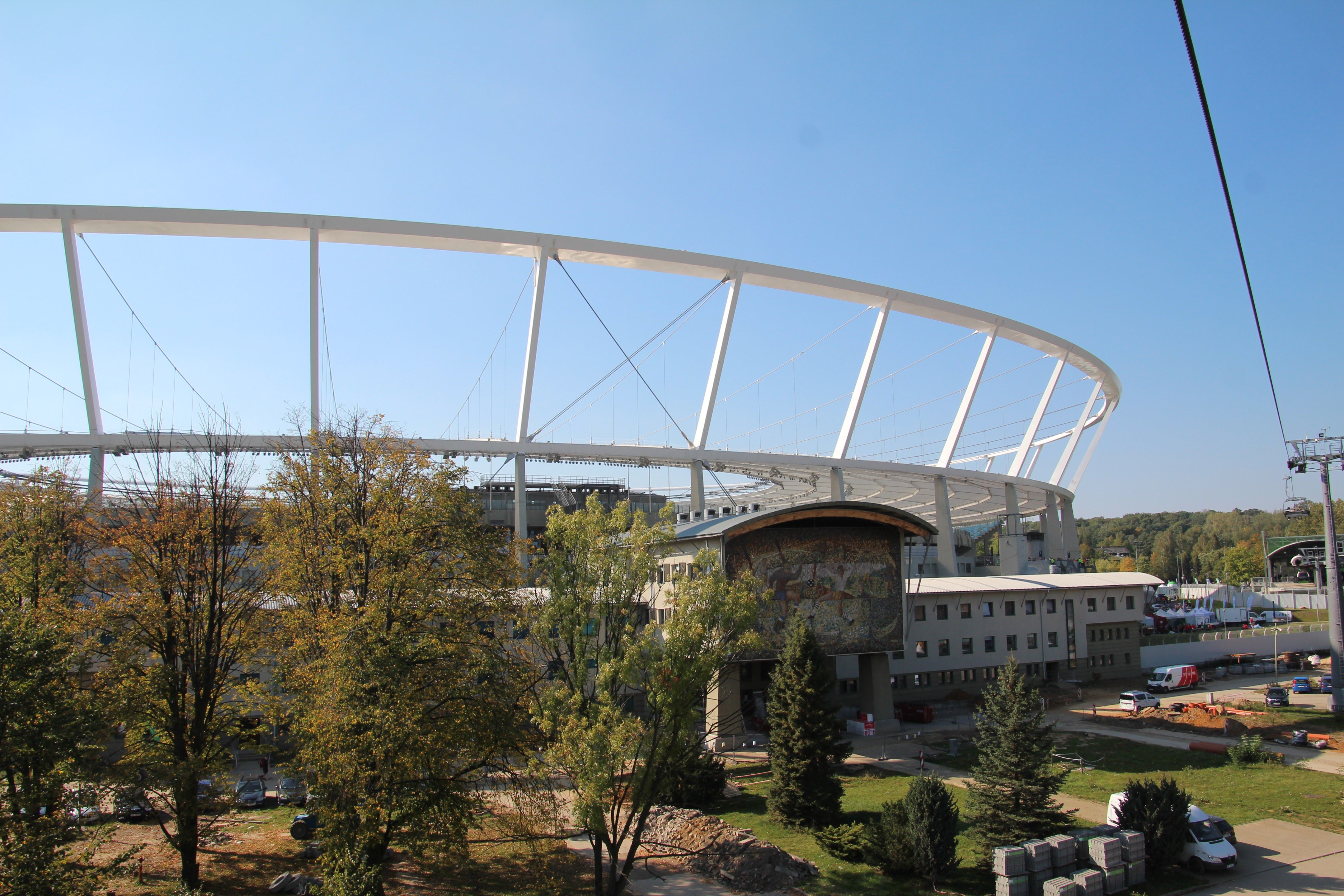 Modern Stadium Architecture in Urban Park Setting · Free Stock Photo