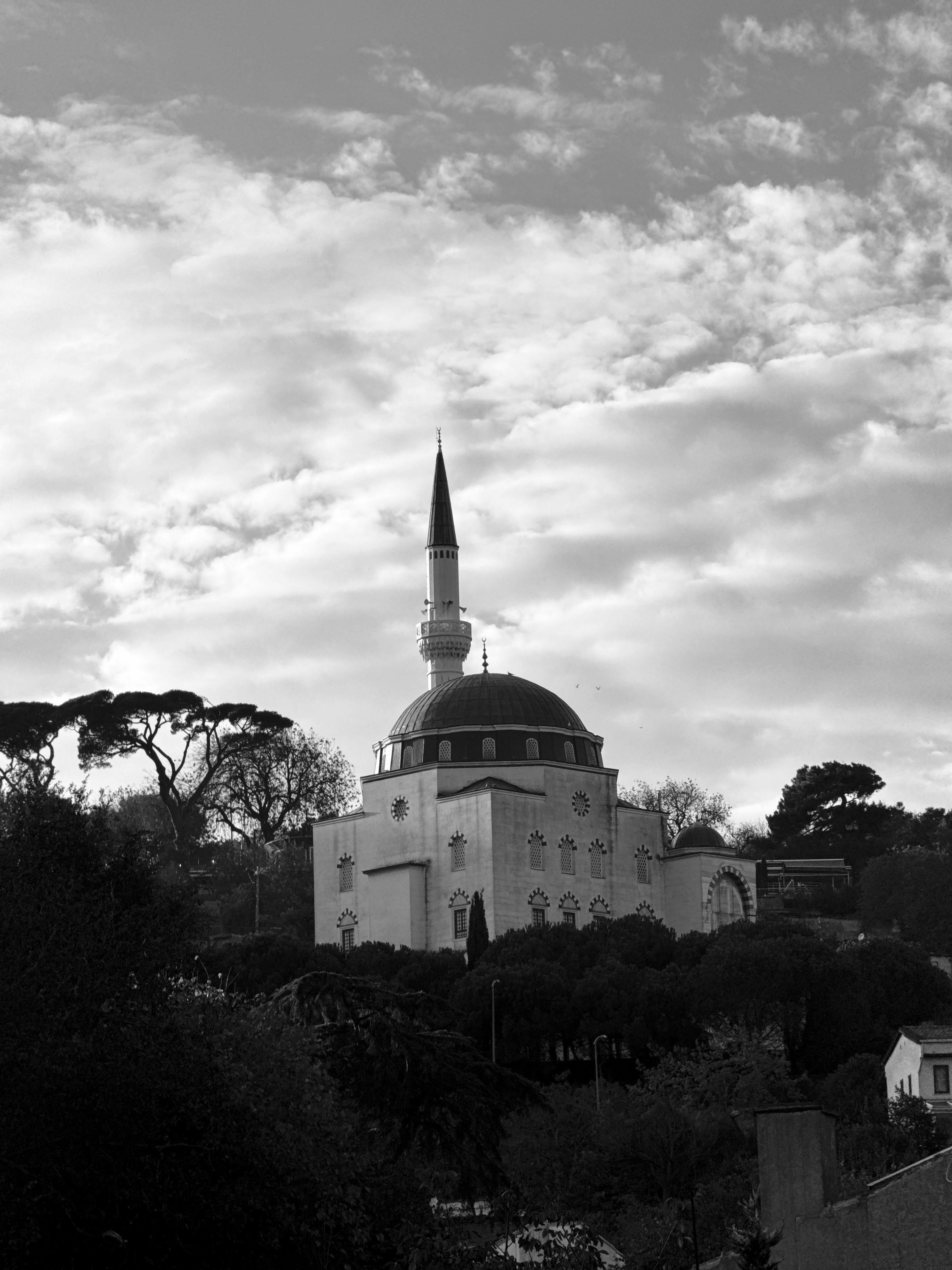 Elegant Mosque Silhouette Against Cloudy Sky · Free Stock Photo