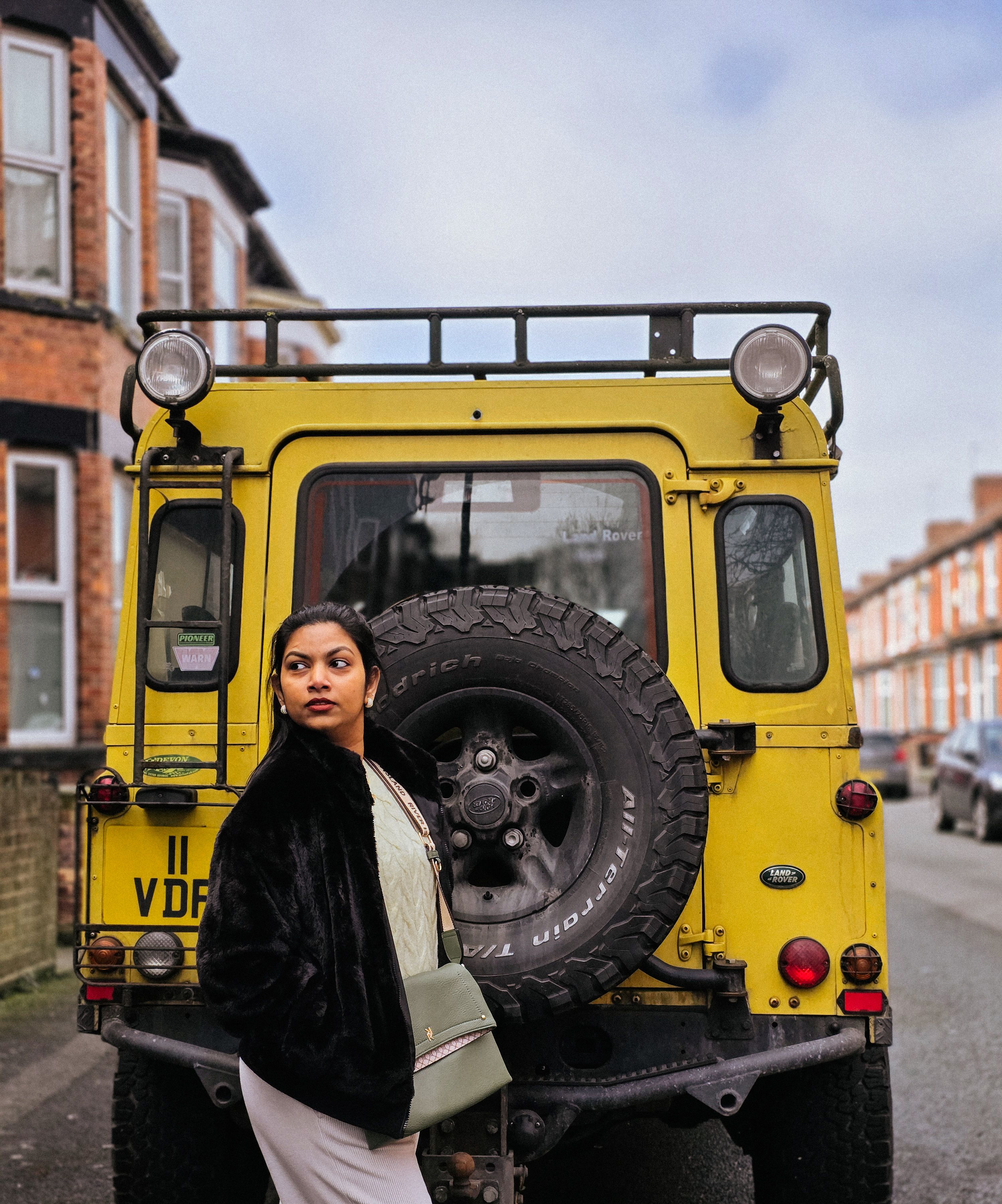 Stylish Woman Poses by Yellow Land Rover in Manchester · Free Stock Photo