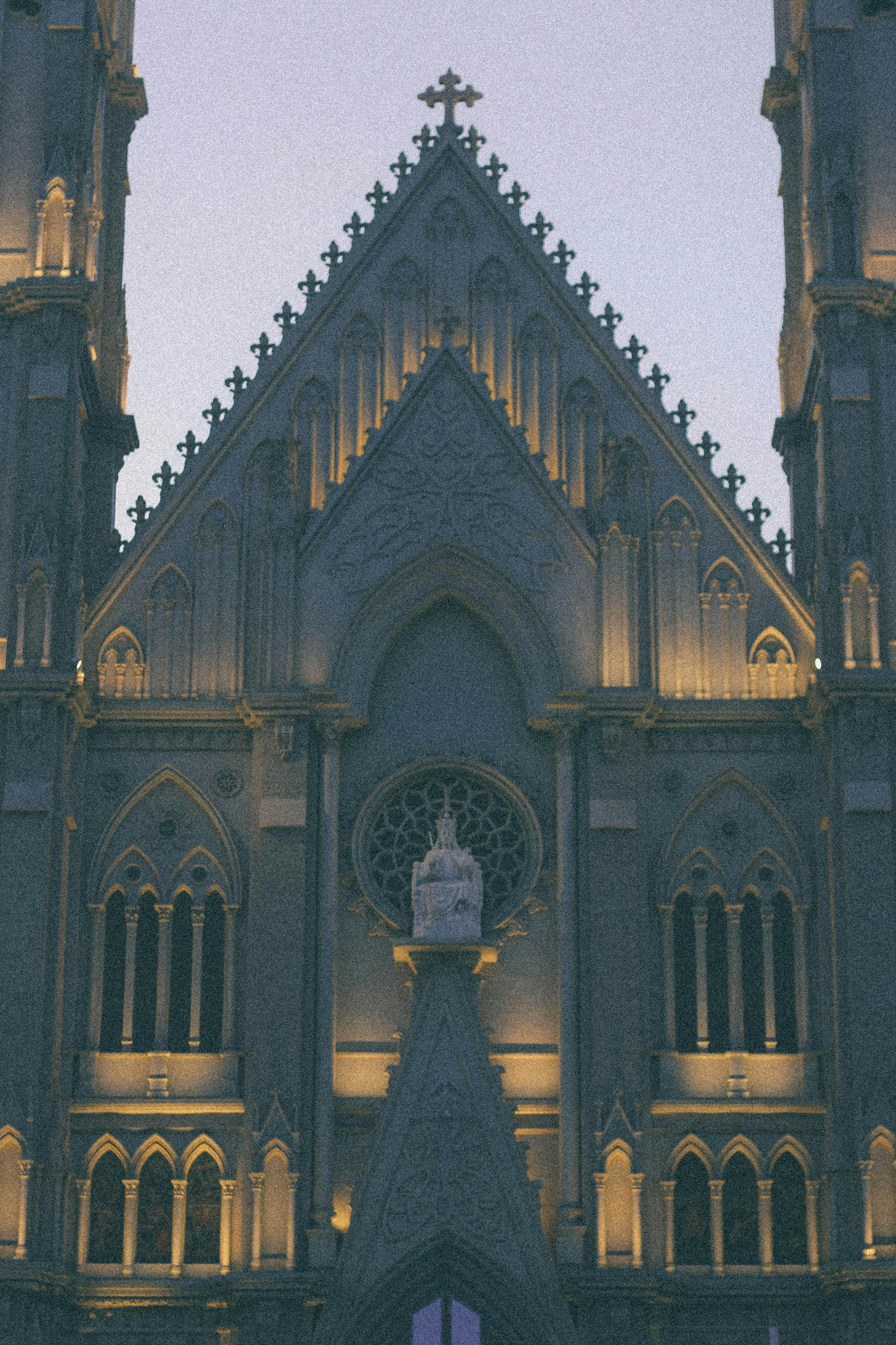 Gothic Revival Church Facade at Twilight · Free Stock Photo