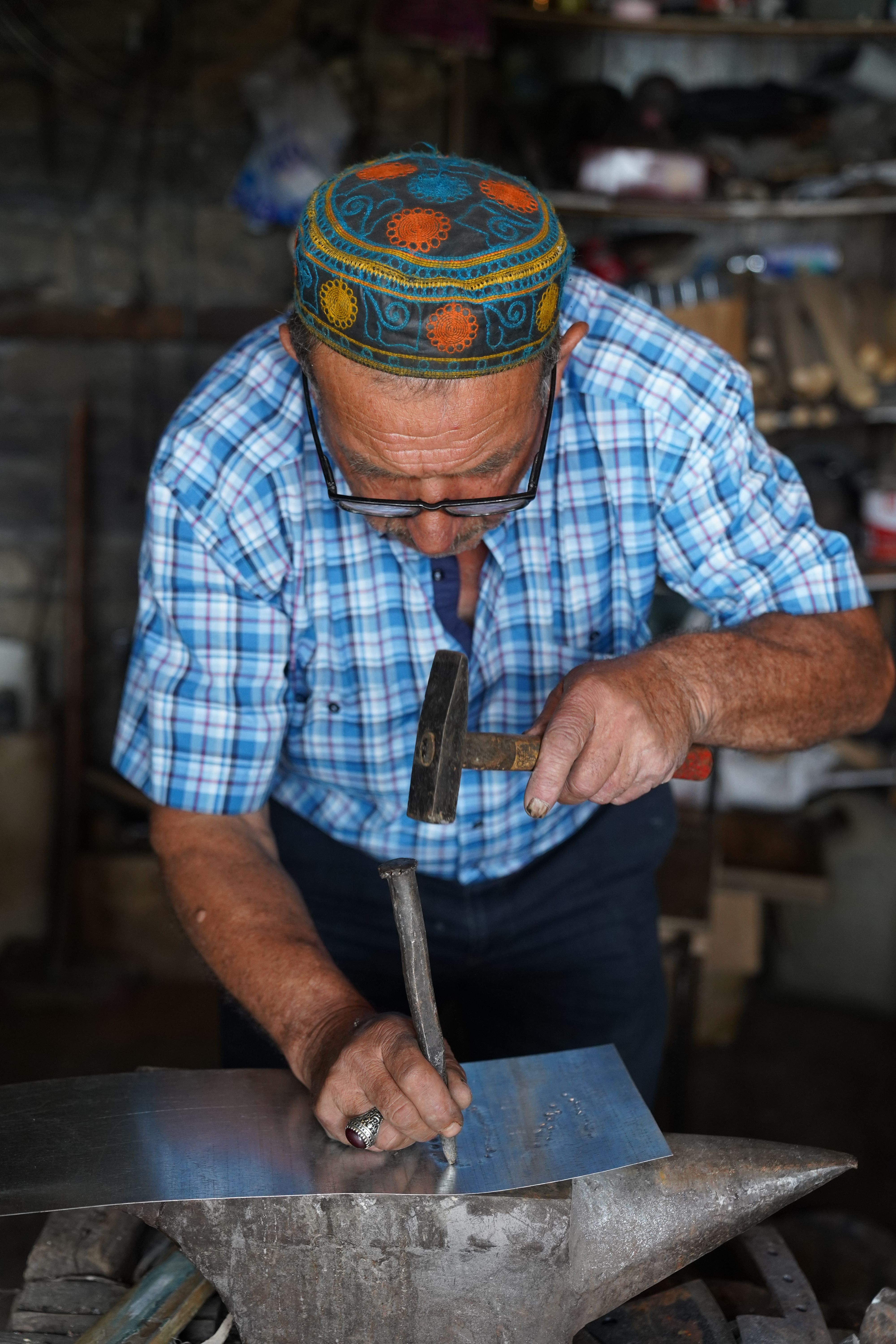 Skilled Blacksmith Hammering Metal on Anvil · Free Stock Photo