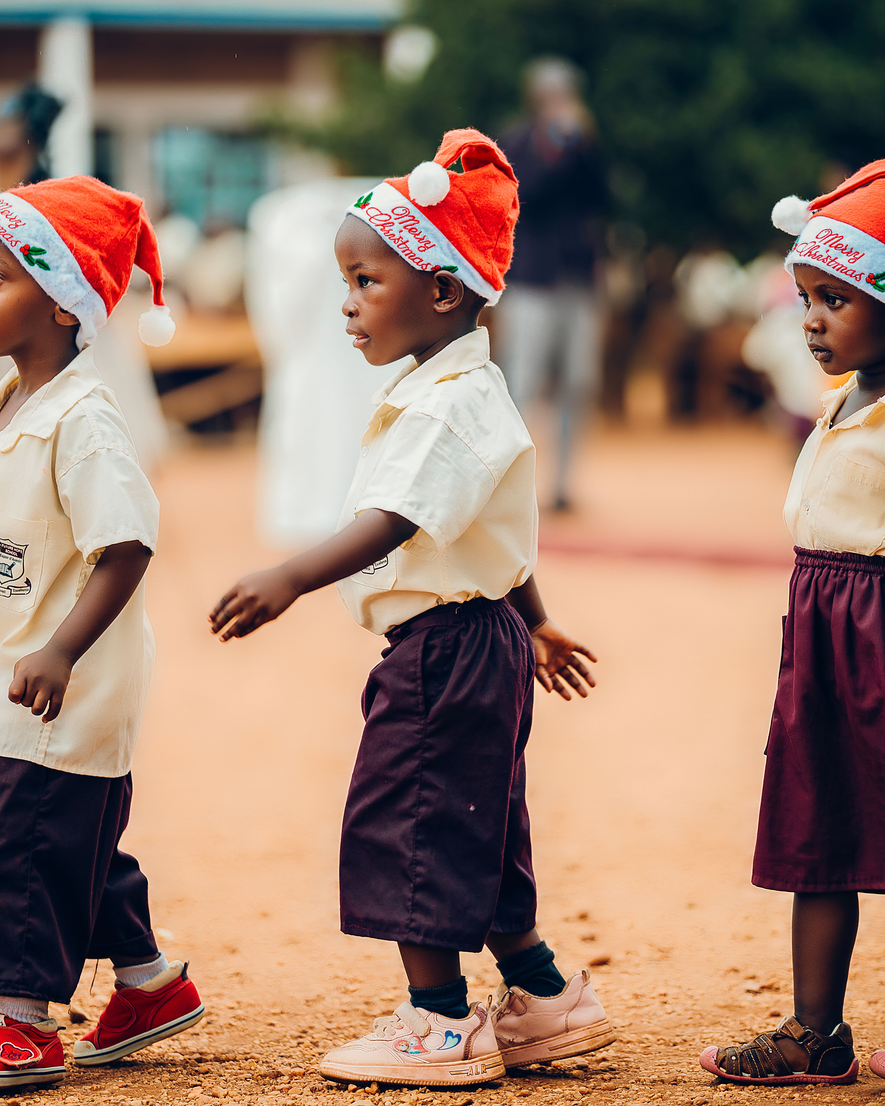 Children in Festive Hats Celebrating Outdoors · Free Stock Photo