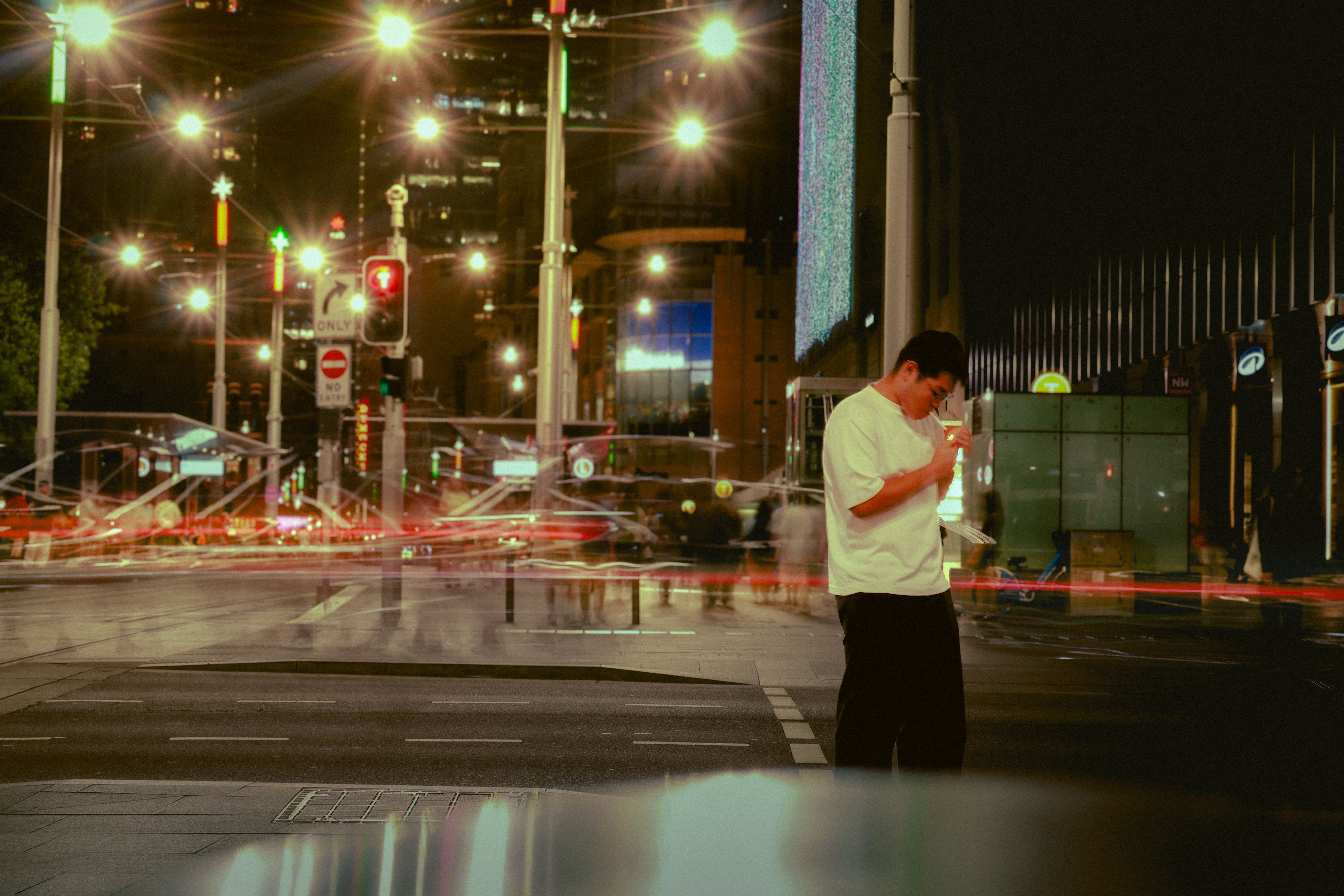 Urban Night Scene with Blurred Motion and Pedestrian · Free Stock Photo