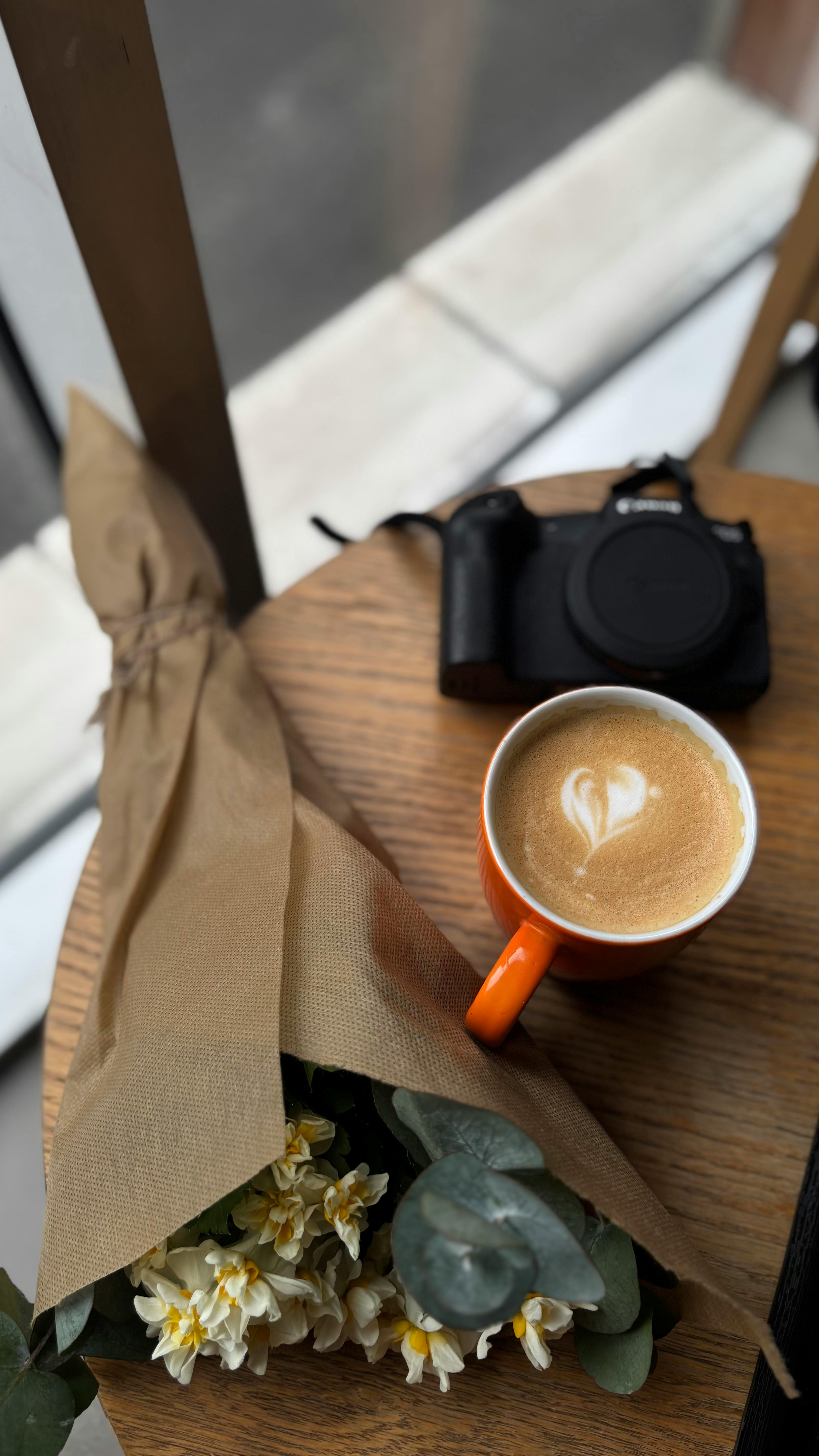 Camera and Bouquet on Stone Table Setting · Free Stock Photo
