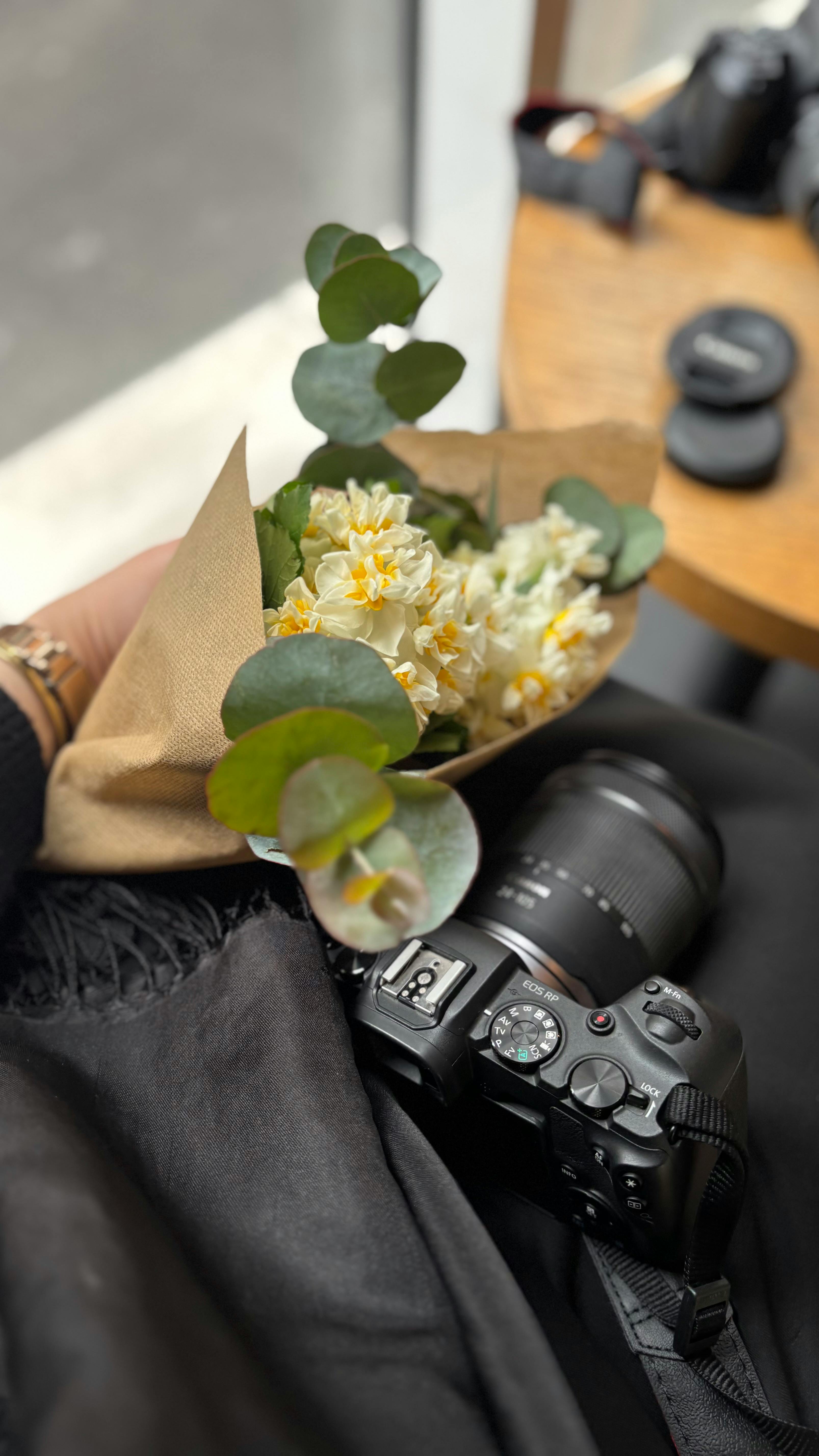Camera and Bouquet on Stone Table Setting · Free Stock Photo