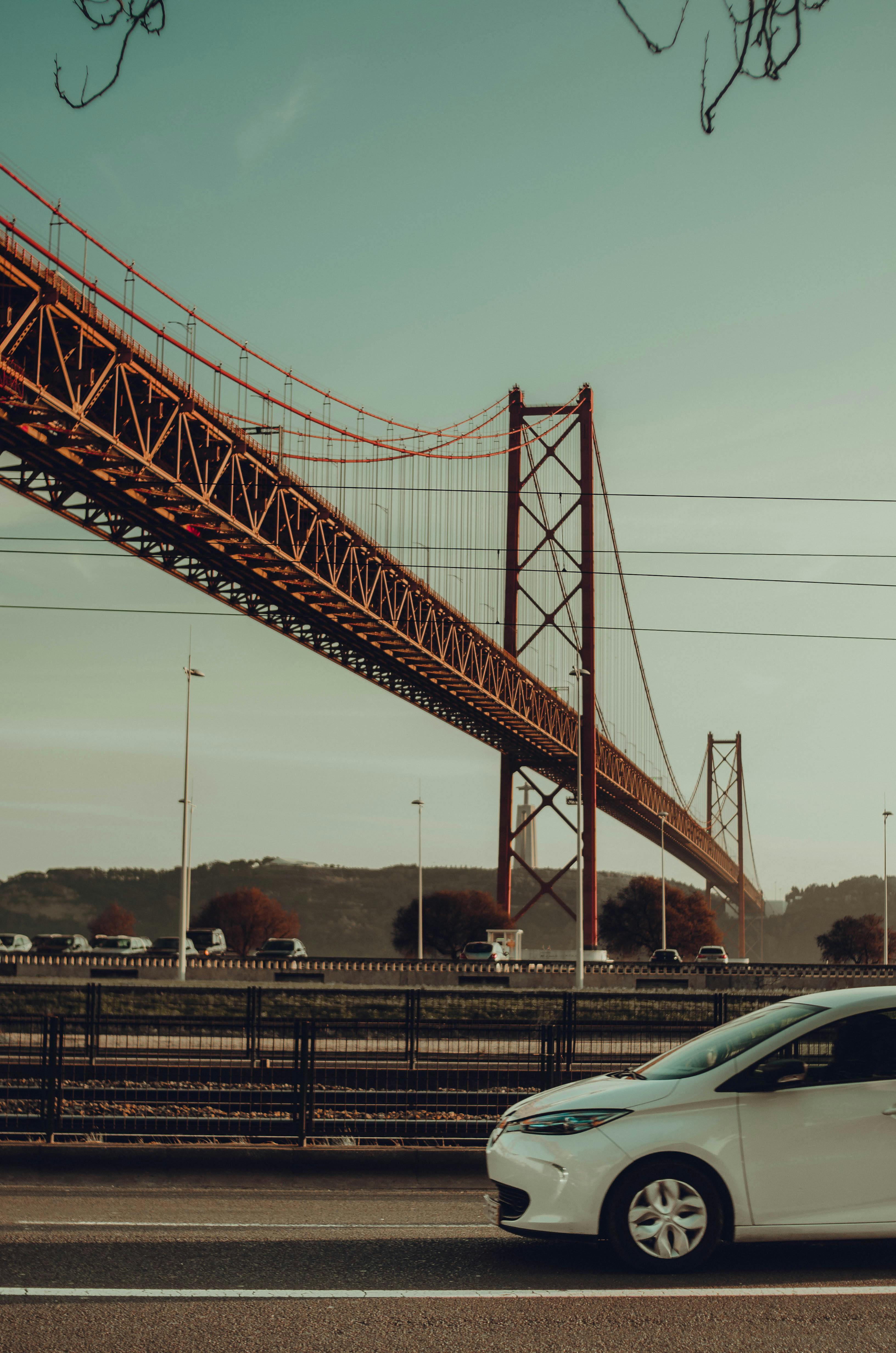 Vehicles on Road Near Bridge · Free Stock Photo