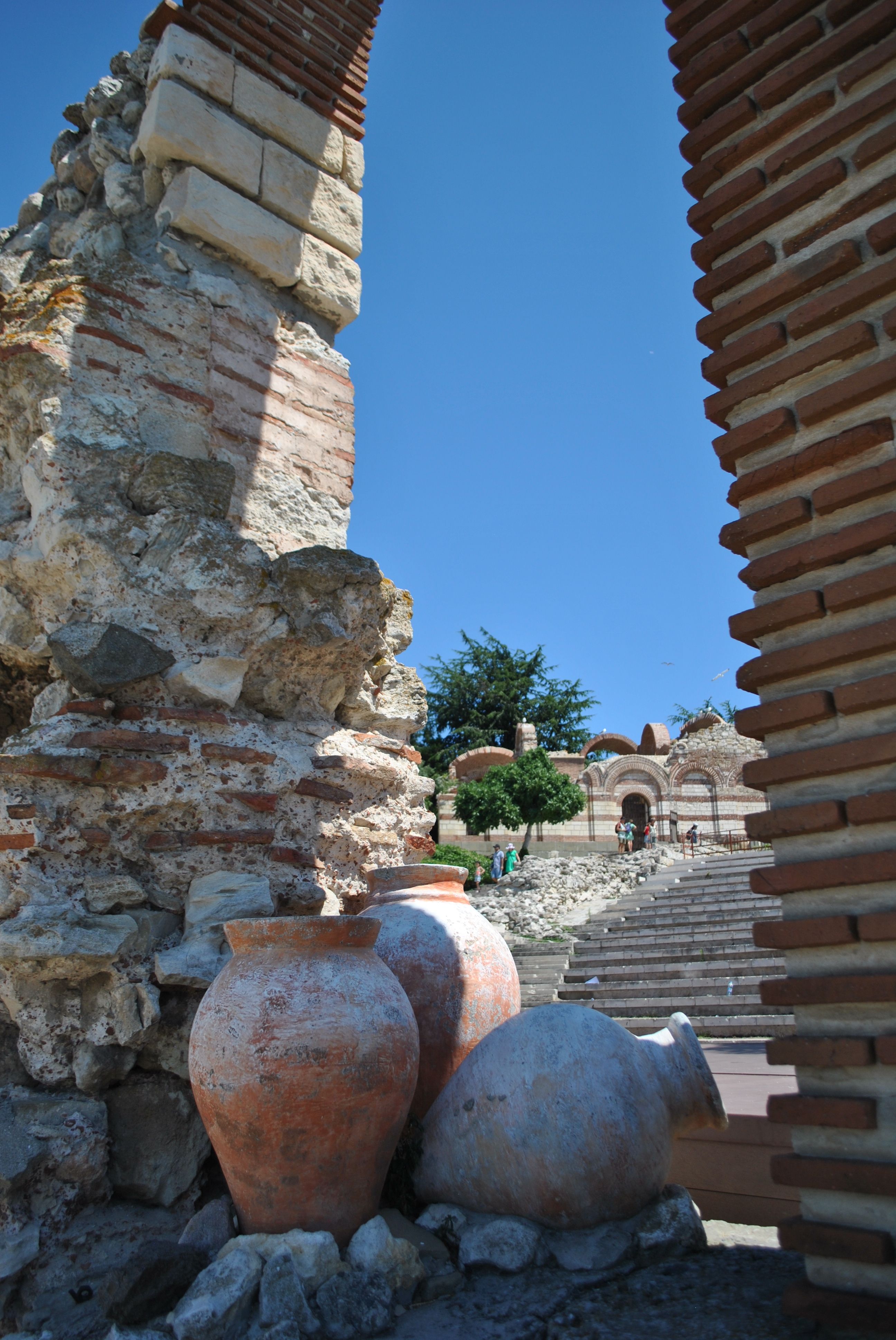 Ancient Ruins with Clay Pots and Archway · Free Stock Photo