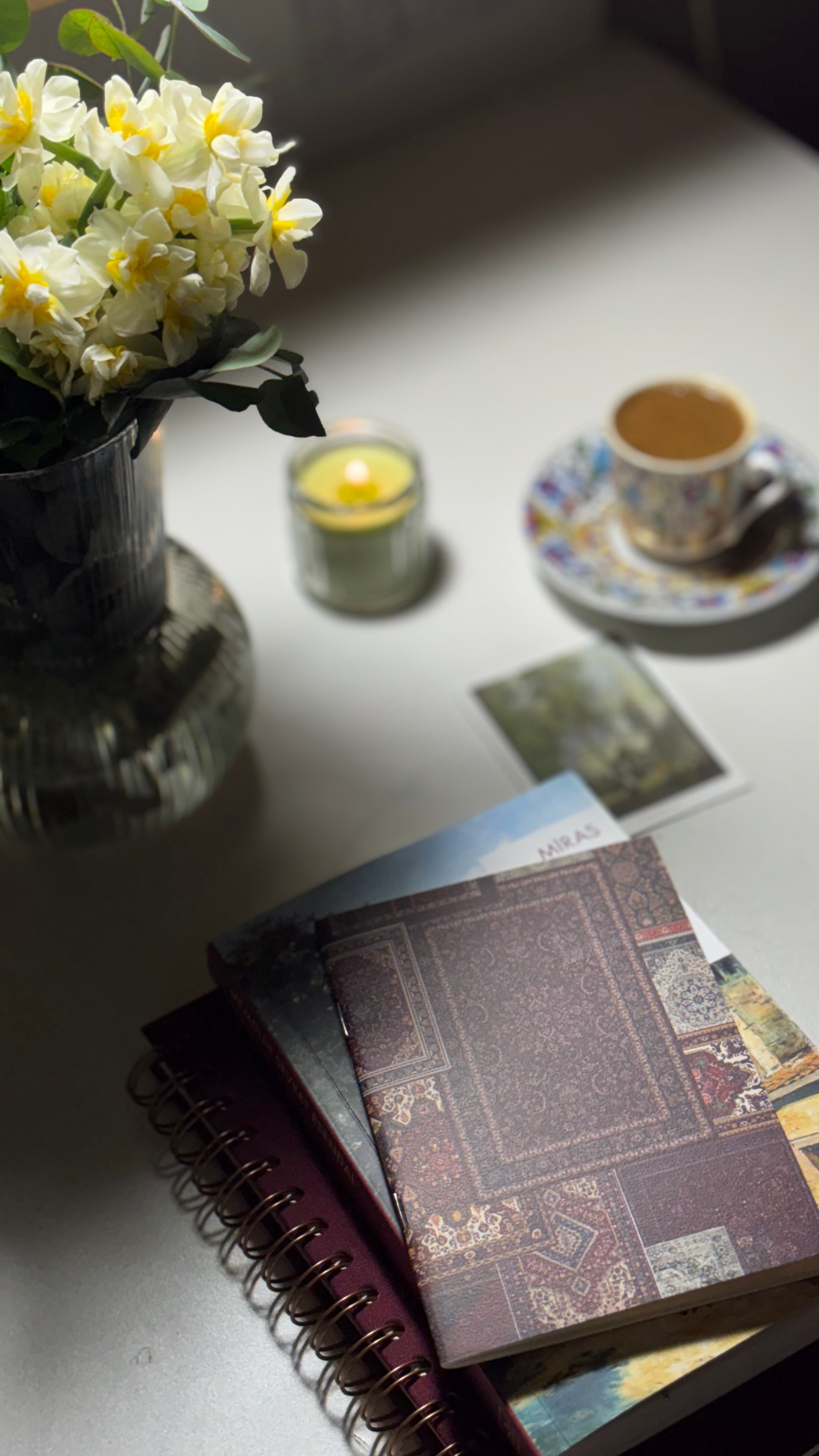 Cozy Desk Setup with Coffee and Journals · Free Stock Photo