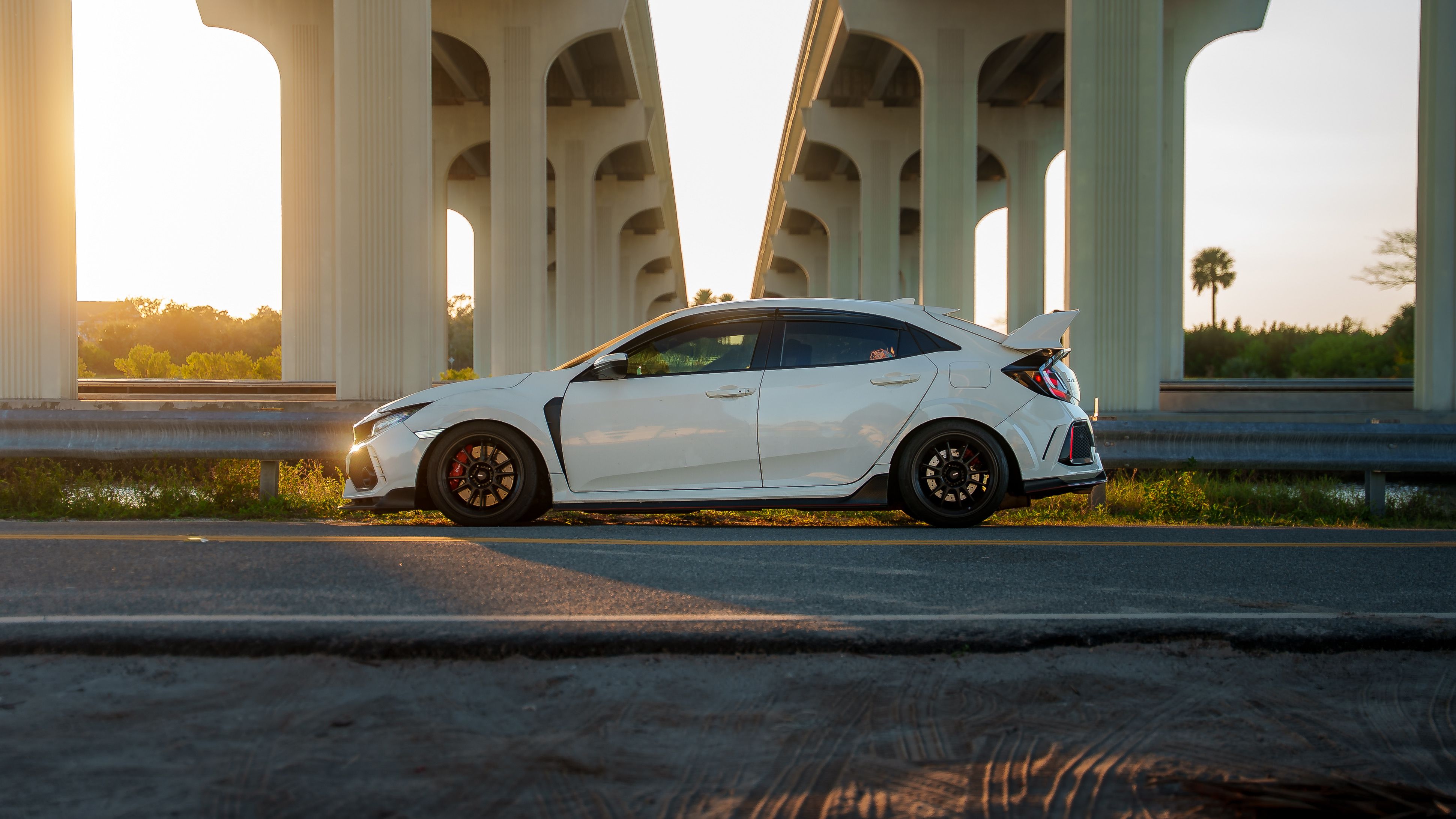 White Sports Car Parked Under Bridge at Sunset · Free Stock Photo