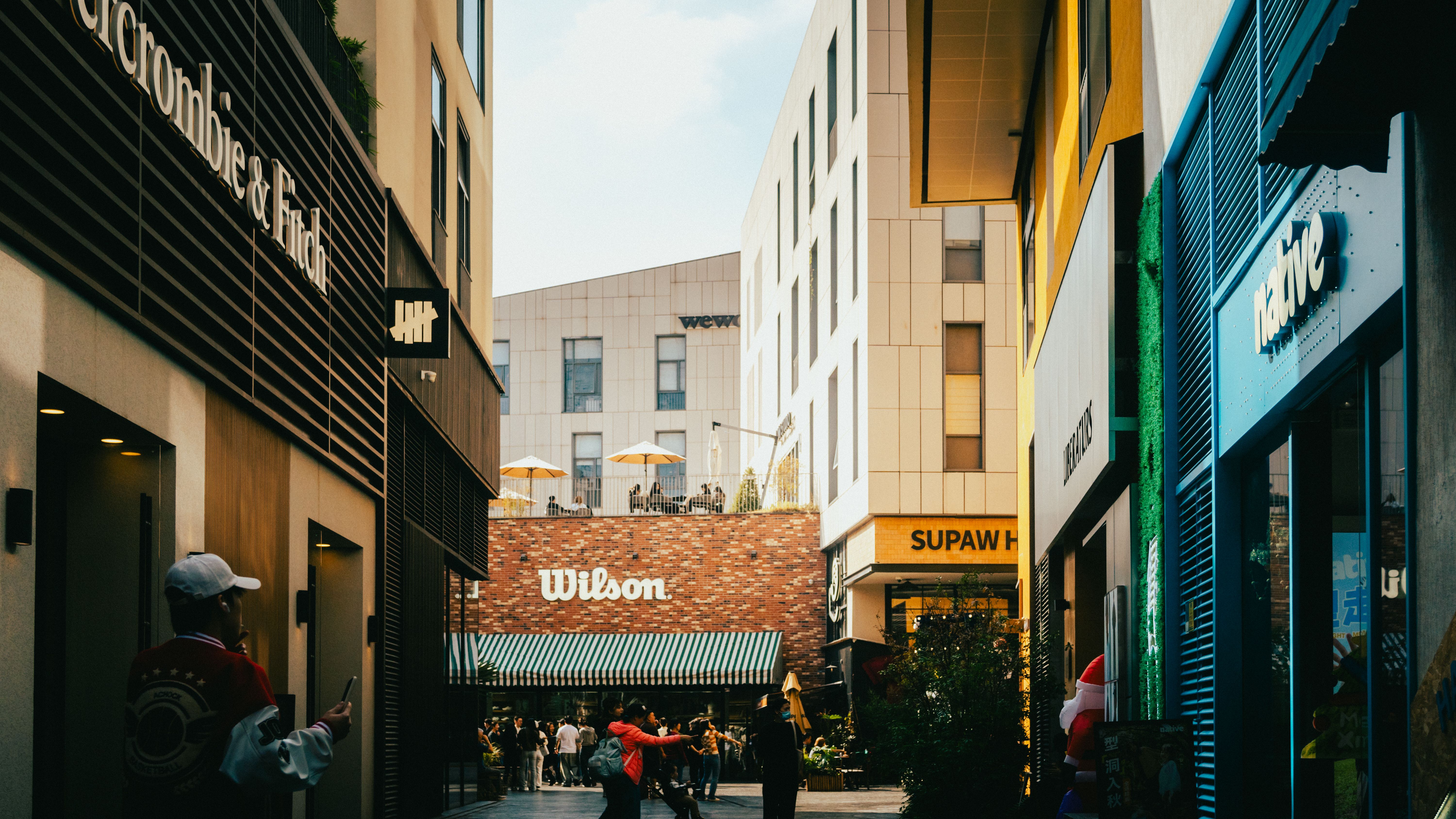 Bustling Urban Alley with Modern Buildings · Free Stock Photo