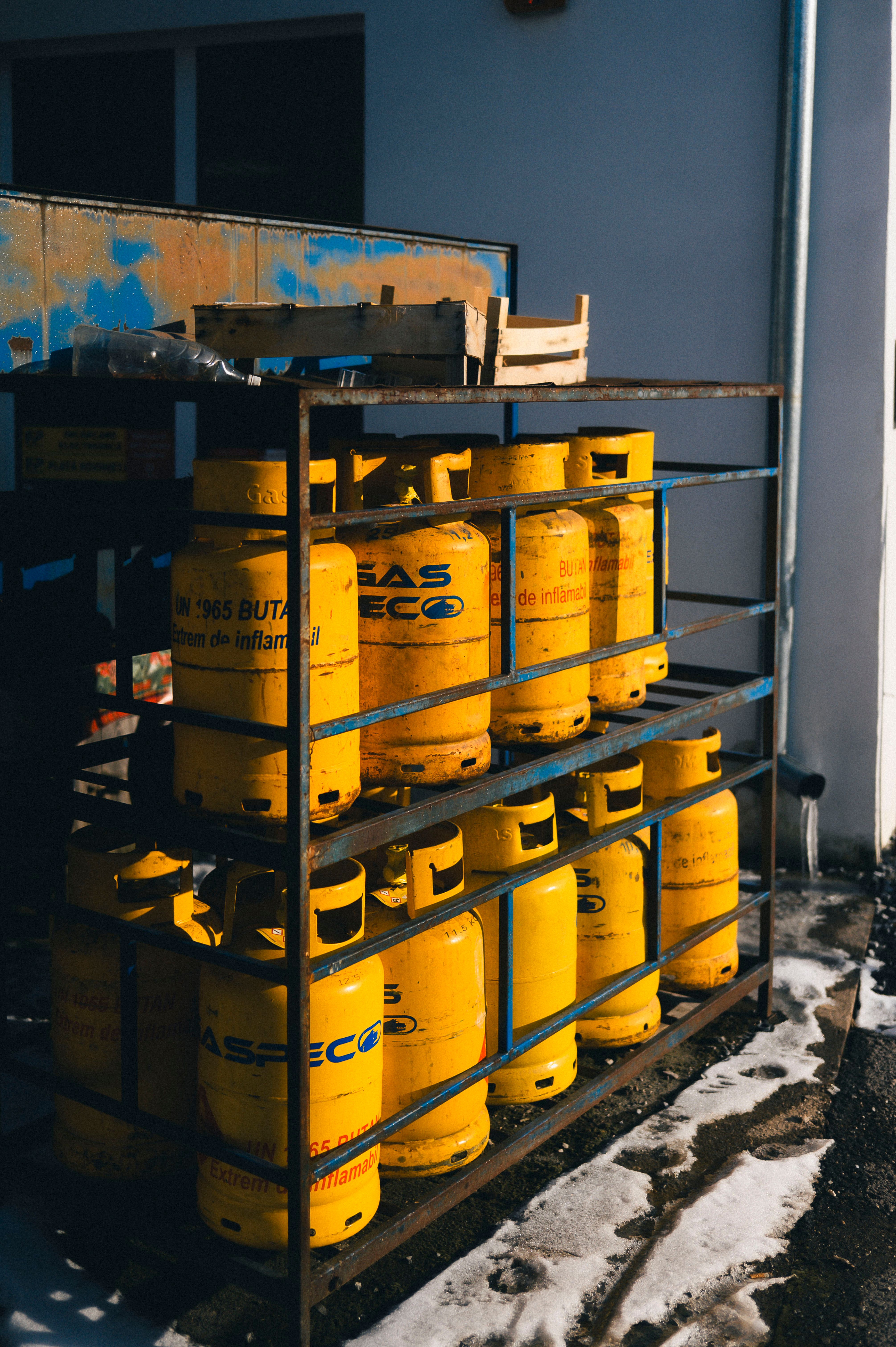 Stacked Yellow Gas Cylinders in Industrial Setting · Free Stock Photo