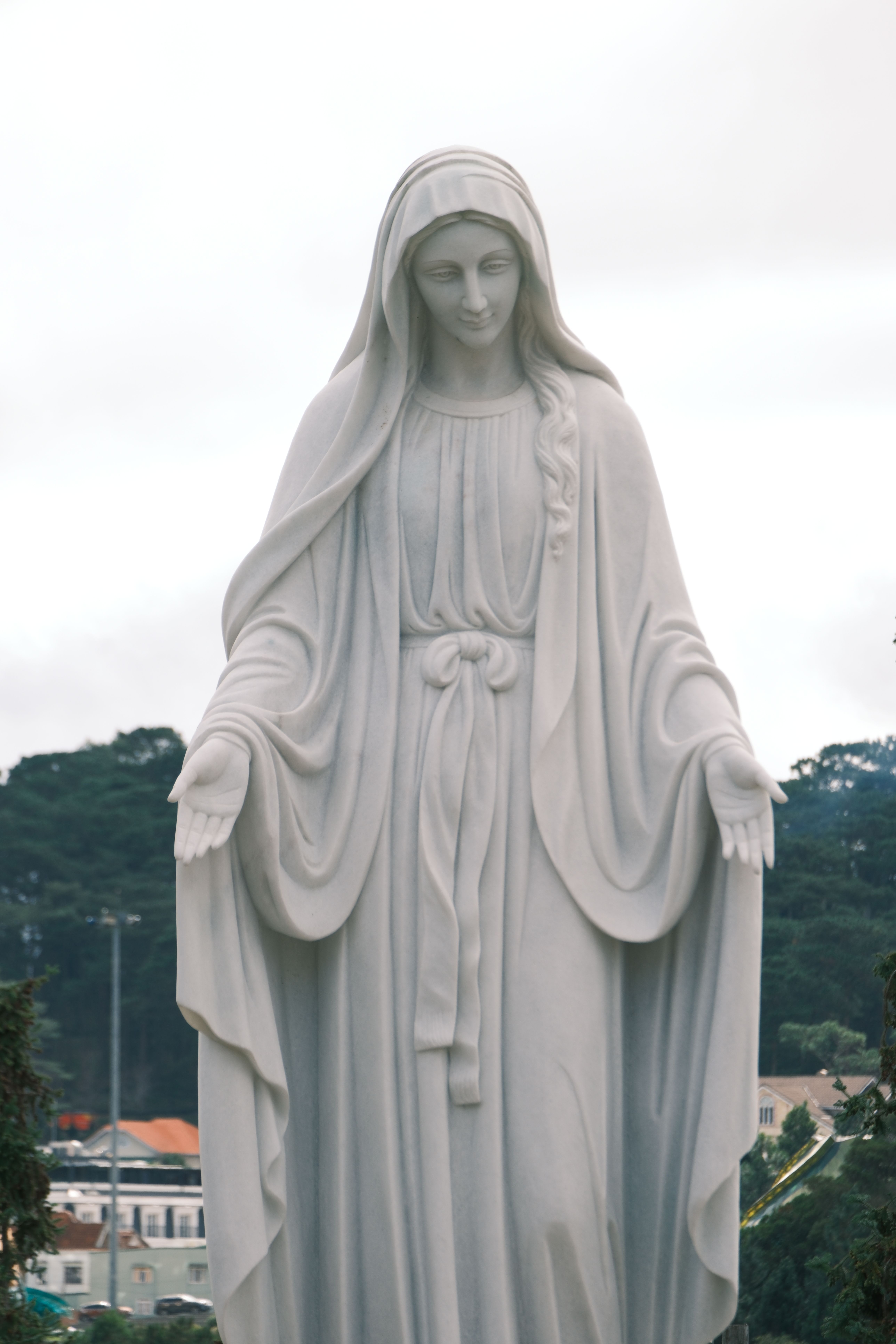 Majestic Marble Statue of Religious Figure Outdoors · Free Stock Photo