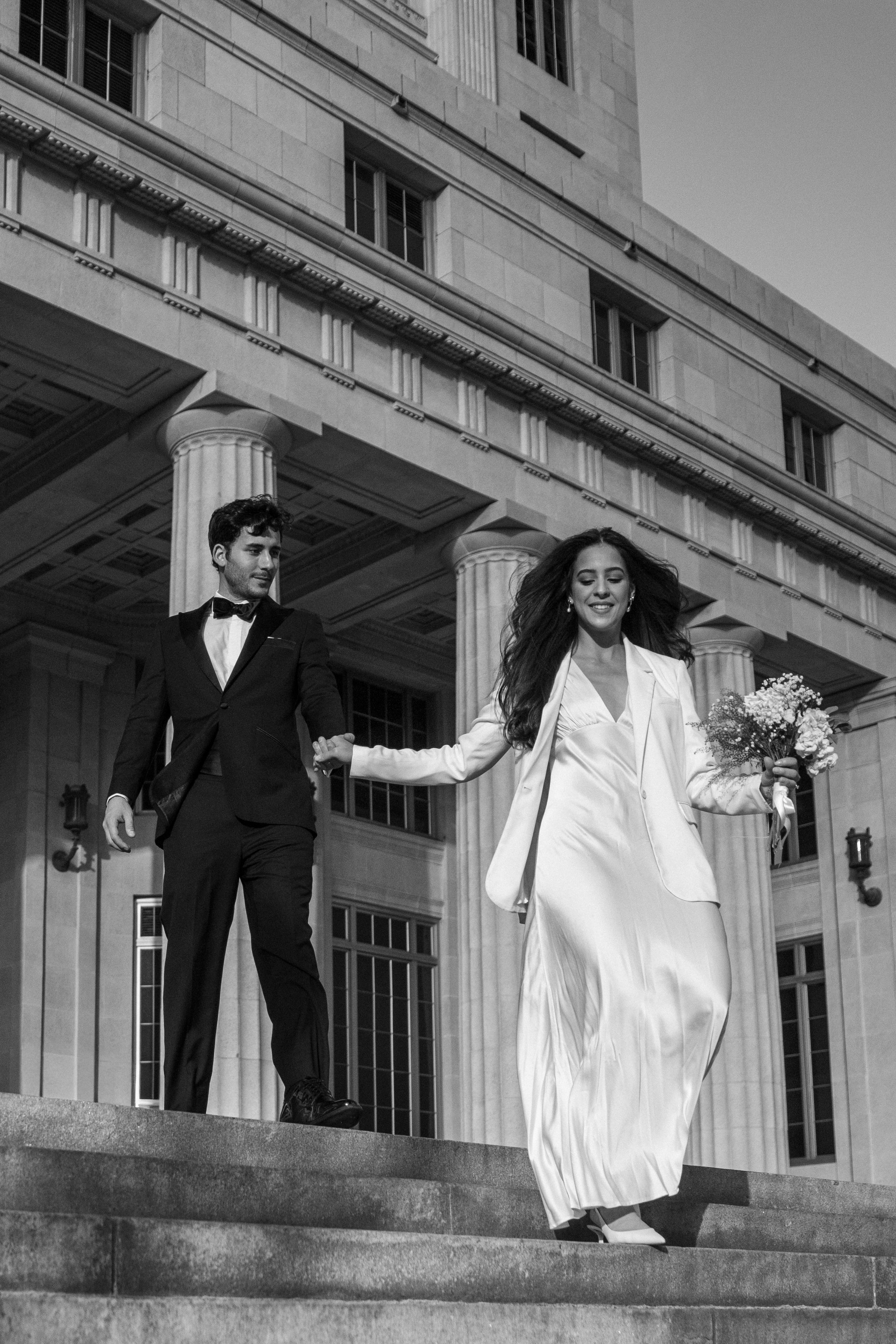 Elegant Wedding Couple Descending Steps · Free Stock Photo