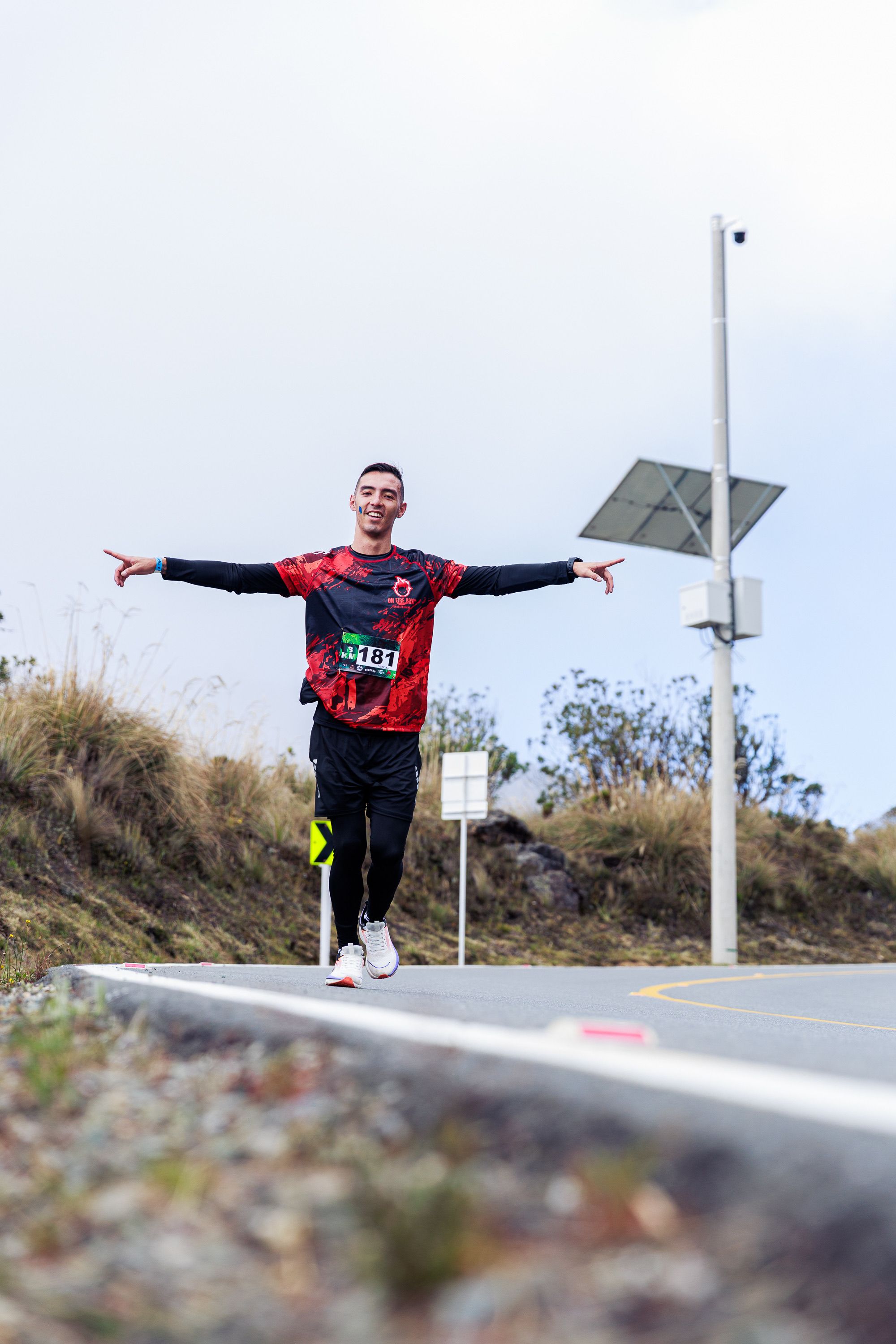 Runner Joyfully Competing in Outdoor Marathon · Free Stock Photo
