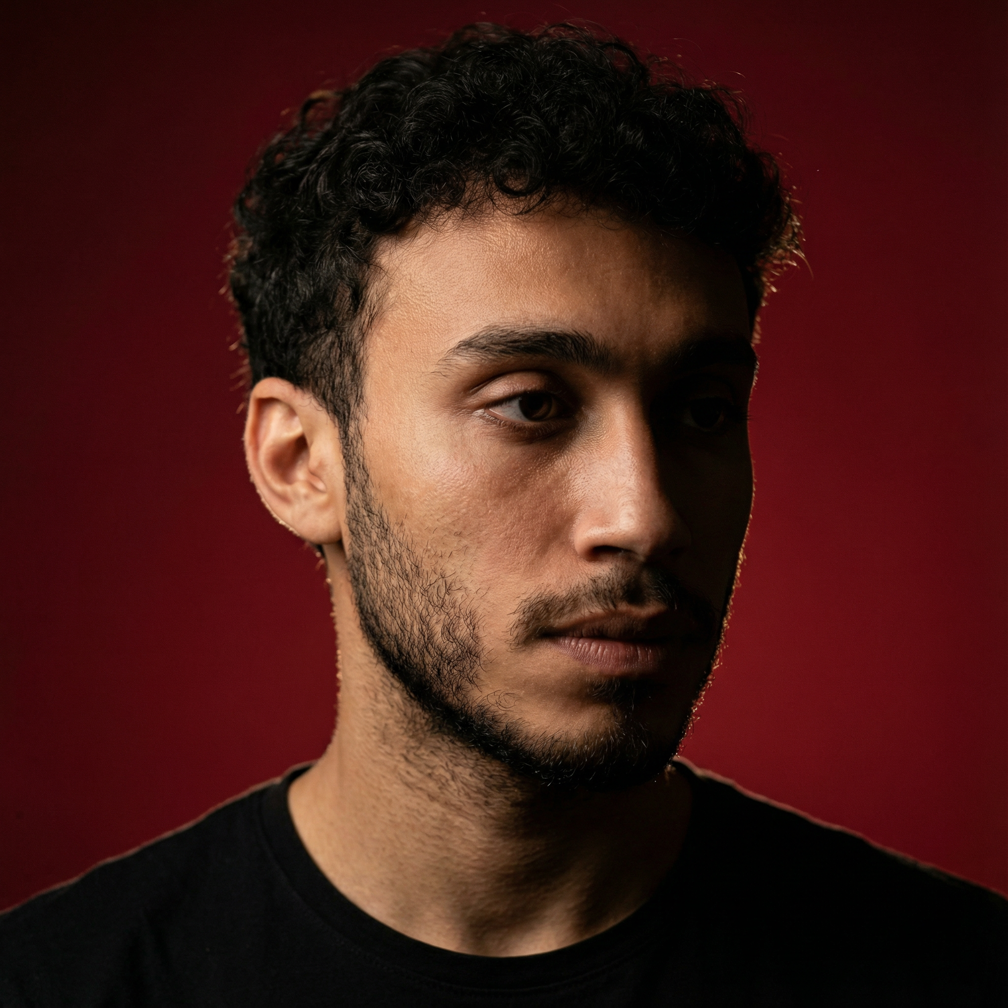 Moody Portrait of Young Man on Red Background · Free Stock Photo