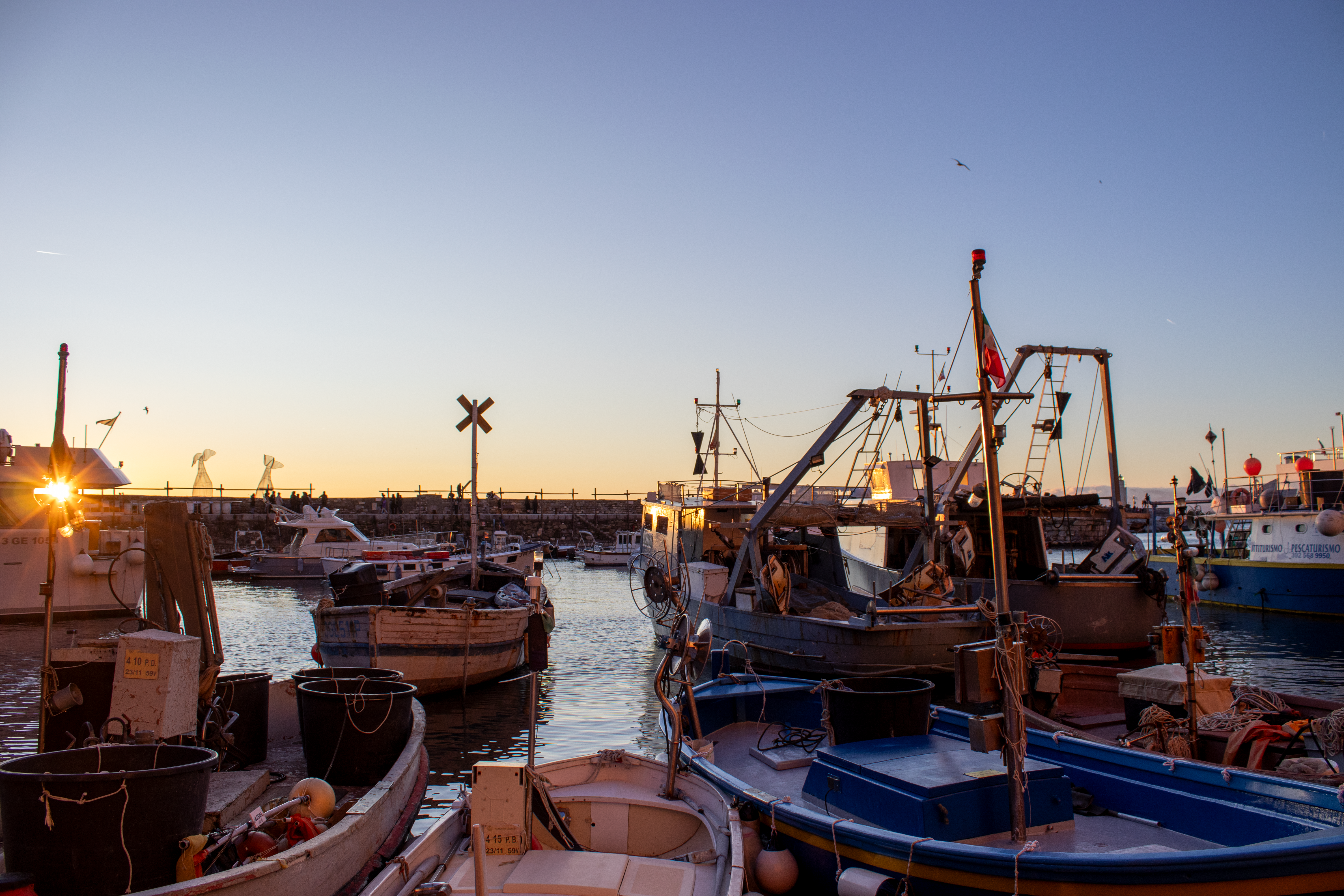 Sunset Over Fishing Boats in Camogli Harbor · Free Stock Photo