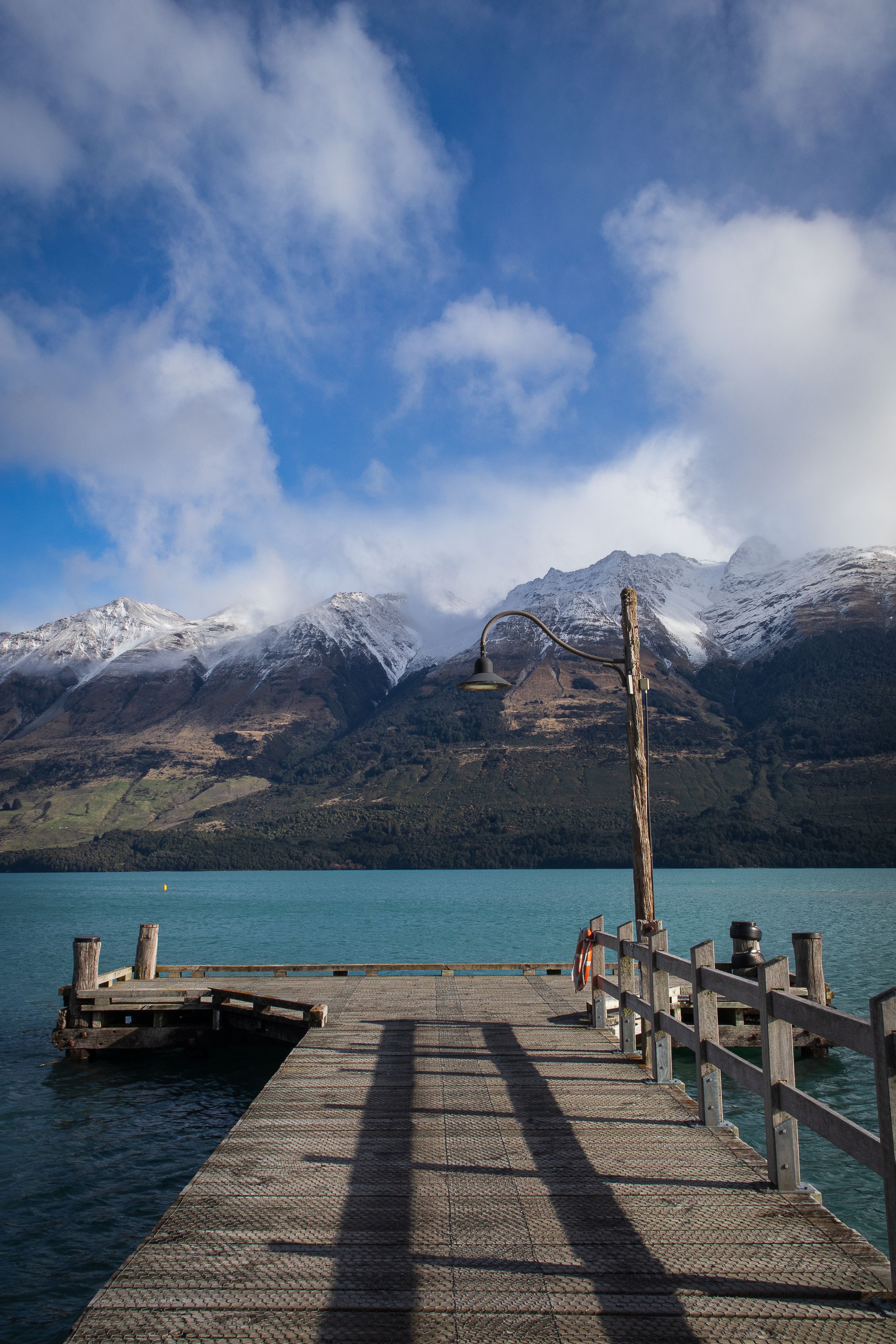 Serene Pier Overlooking Queenstown's Mountains · Free Stock Photo