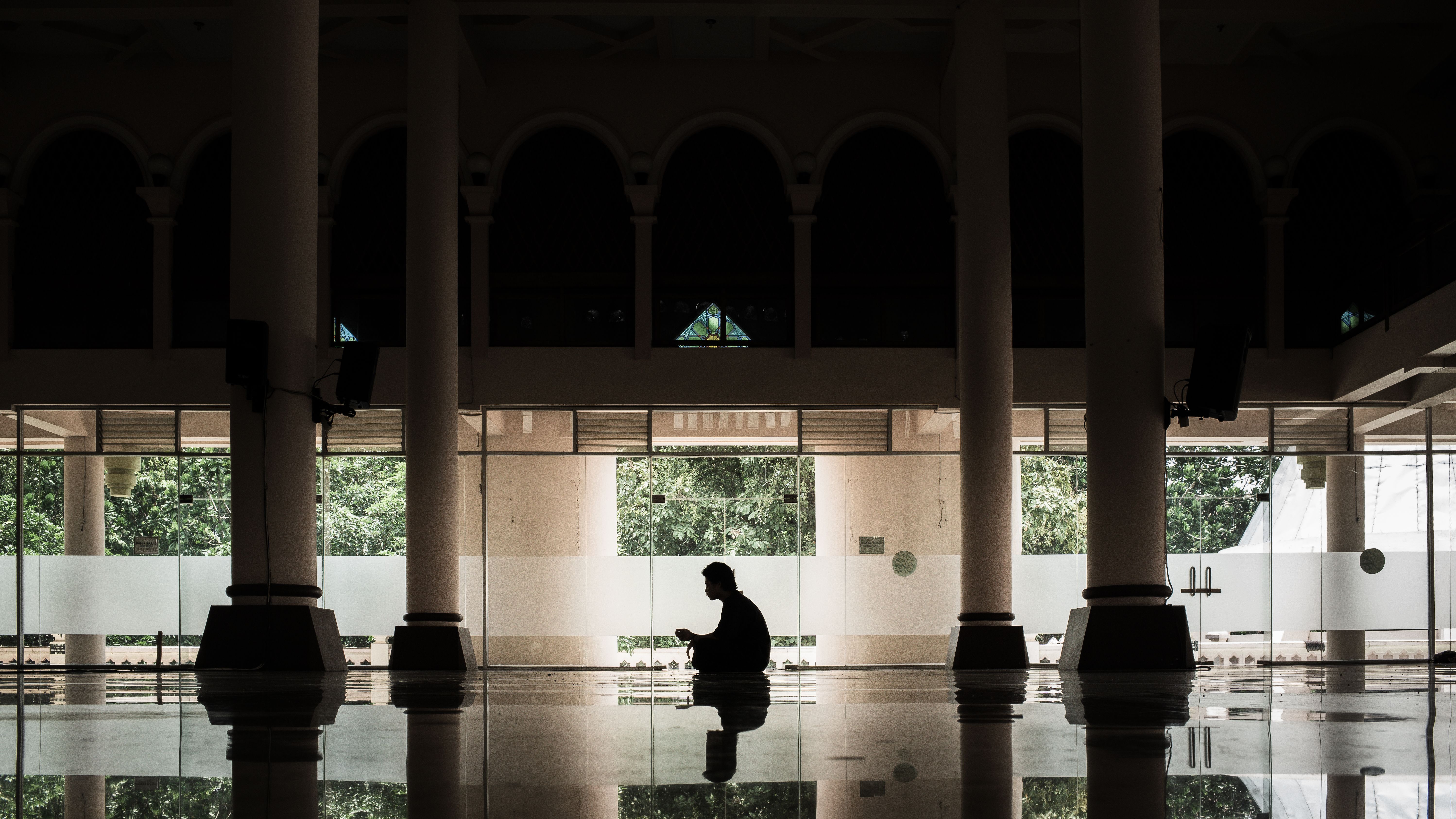 Silhouette of a Person in Modern Indoor Architecture · Free Stock Photo