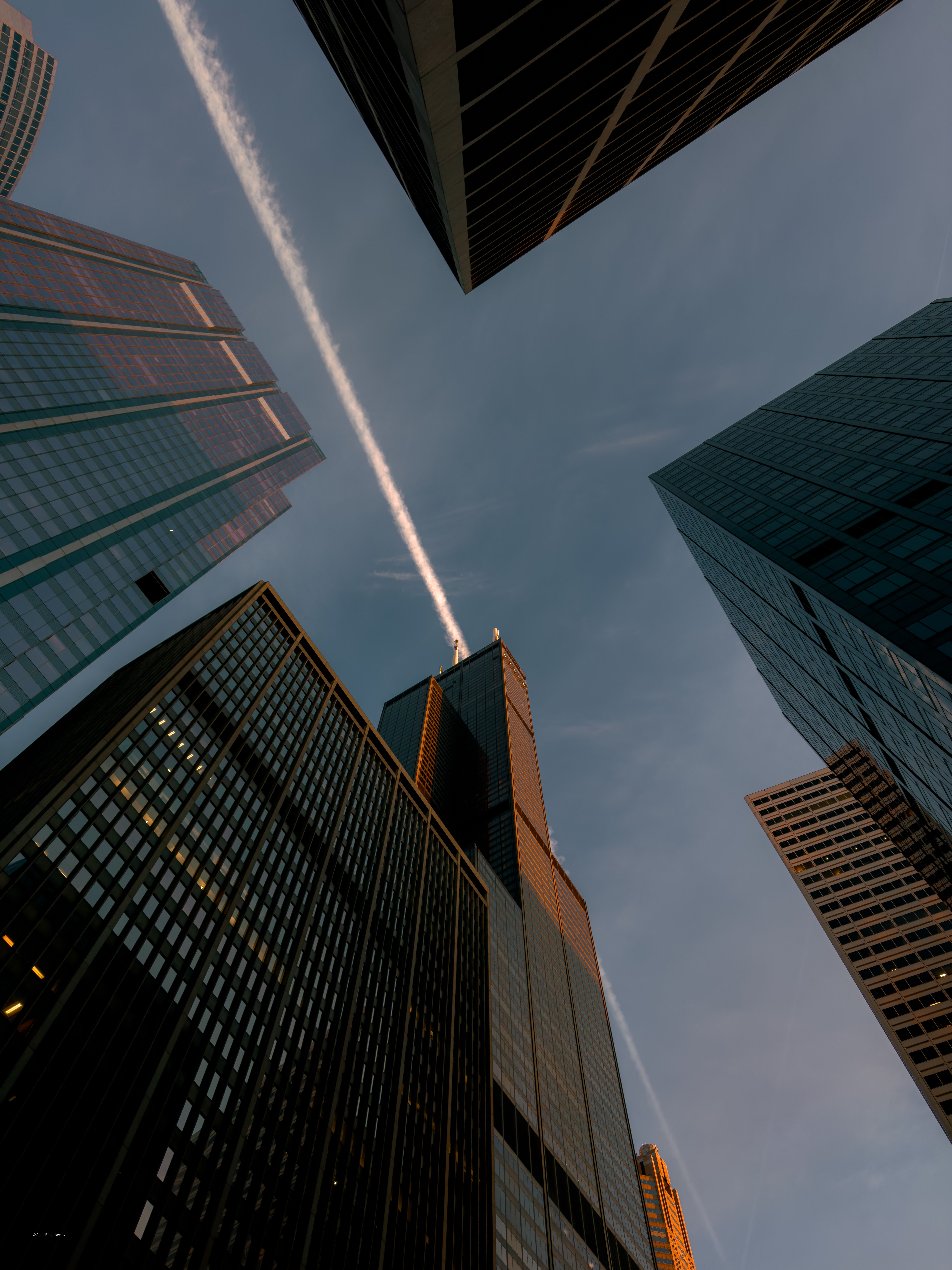 Dynamic city skyline with towering skyscrapers at dusk · Free Stock Photo